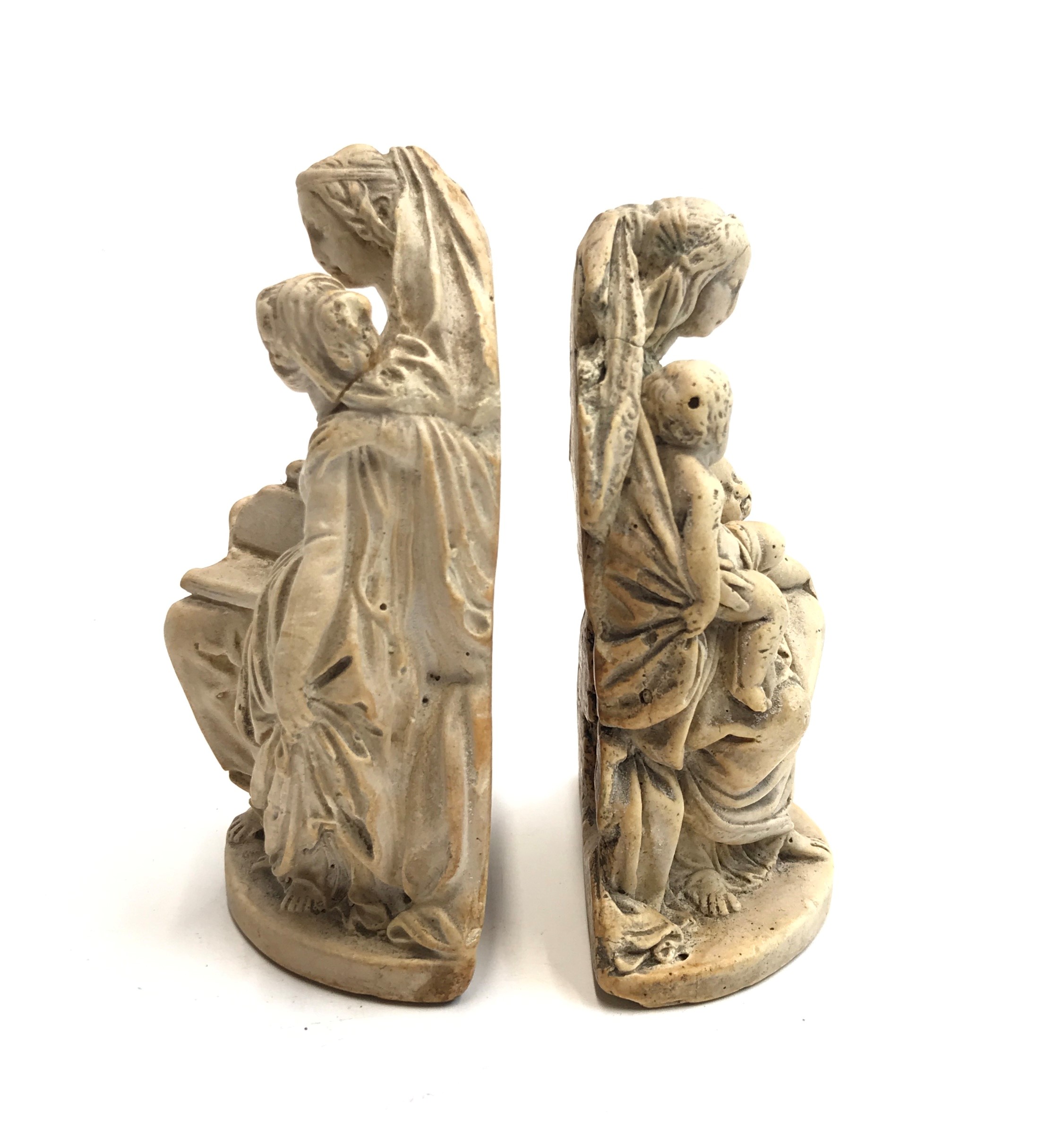 A Nottingham alabaster style figure group depicting a woman with two ...