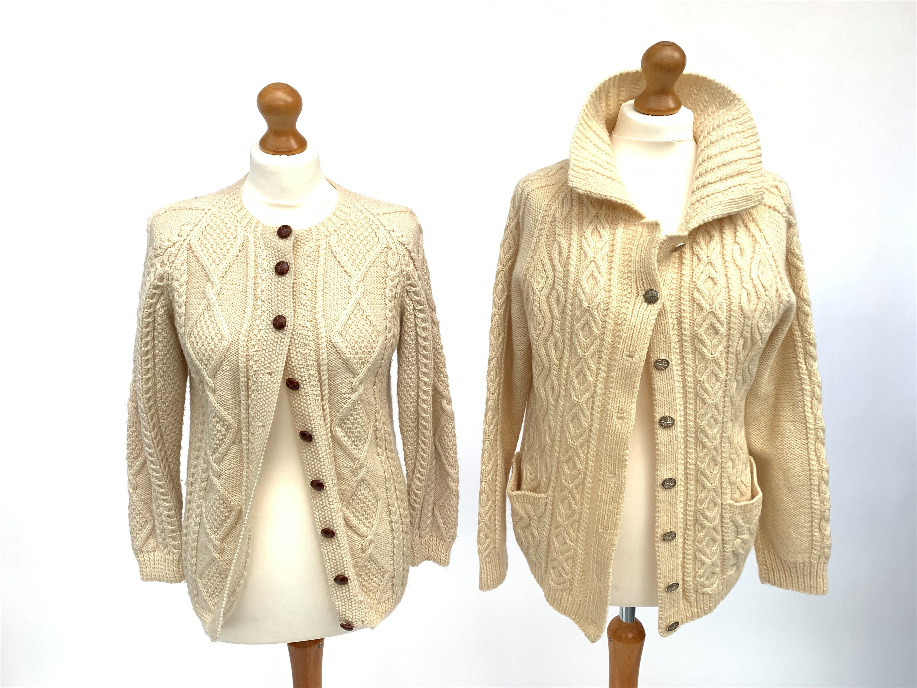 Two Aran style hand knitted cream wool cardigans, one with leather ...