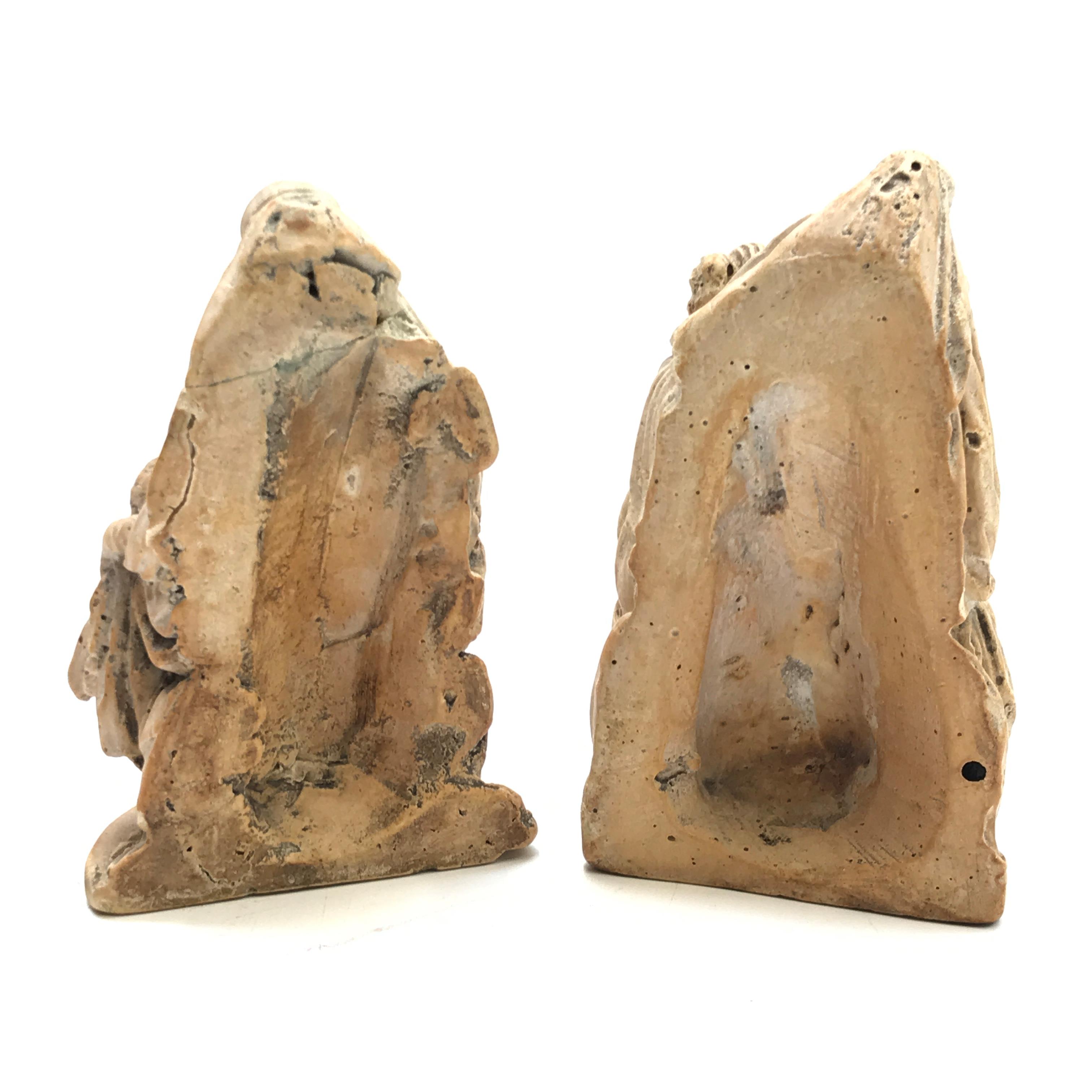 A Nottingham alabaster style figure group depicting a woman with two ...