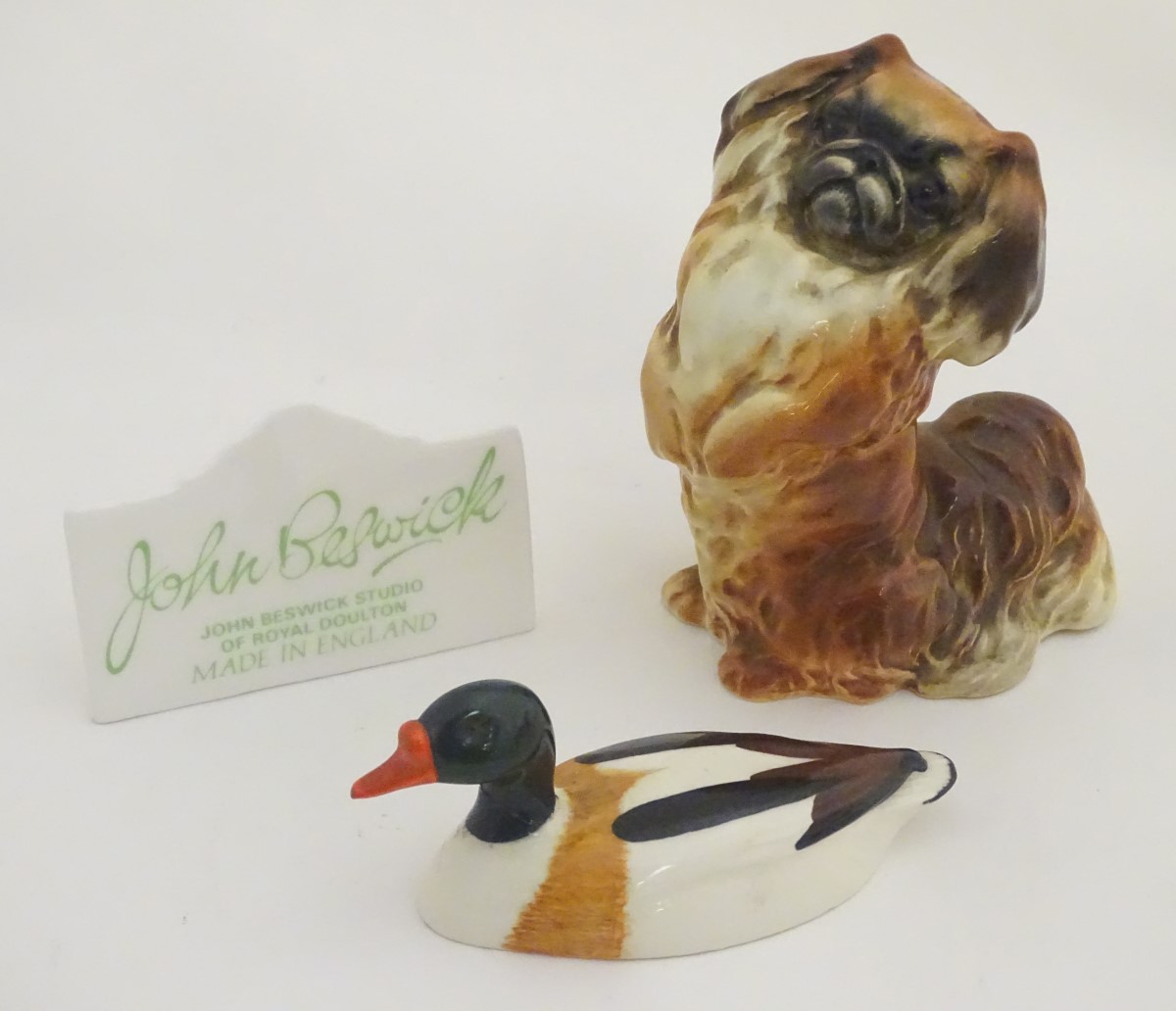 Two Beswick animals, a begging Pekinese dog, model no. 1059, impressed ...
