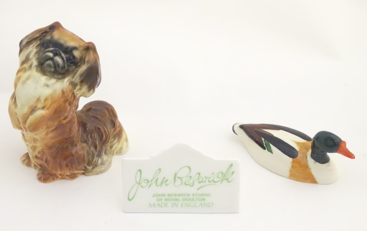 Two Beswick animals, a begging Pekinese dog, model no. 1059, impressed ...