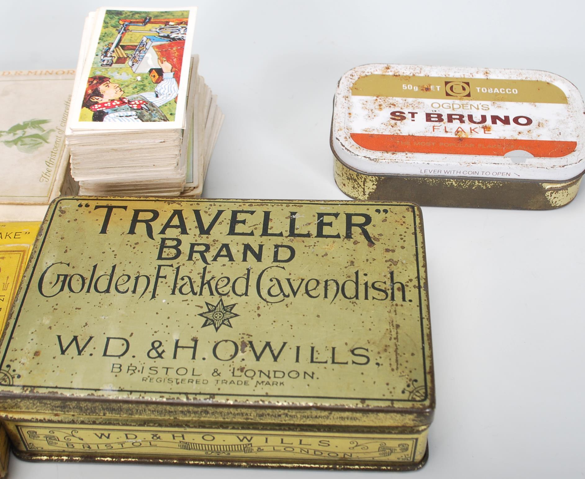 A collection of vintage cigarette packets and cigarette cards, full and ...