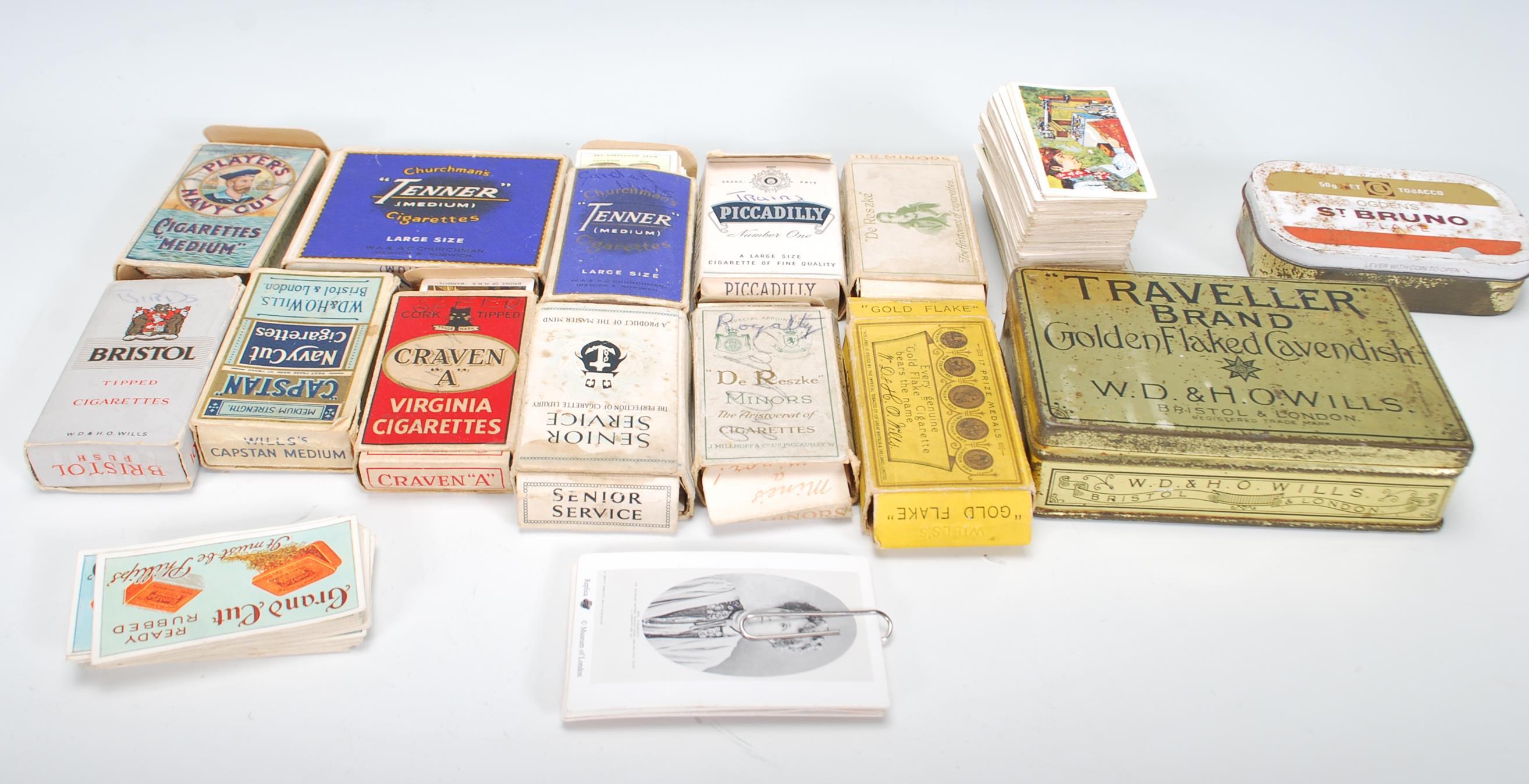 A collection of vintage cigarette packets and cigarette cards, full and ...