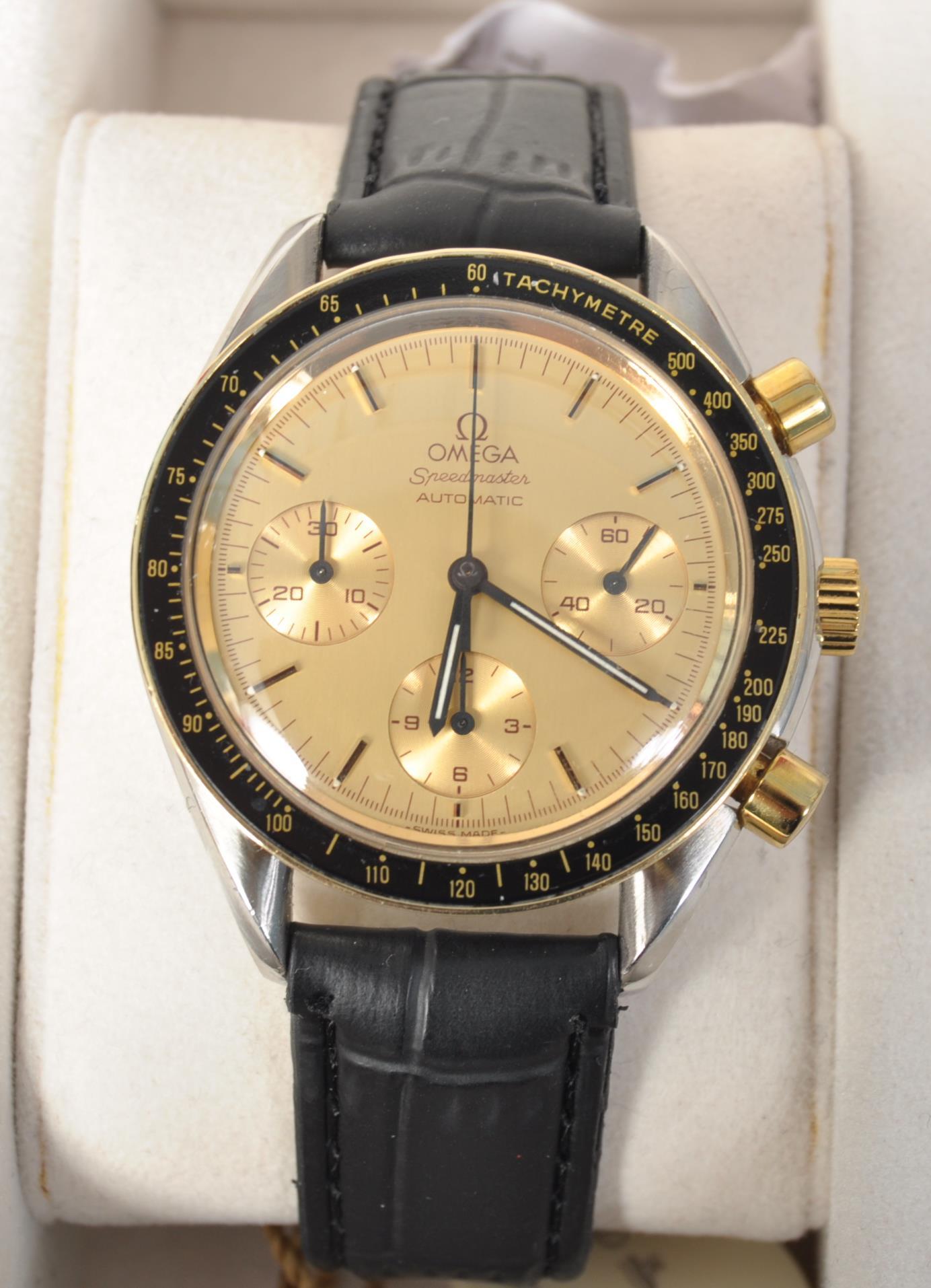 An Omega speedmaster 18ct two tone gold & steel champagne dial ...