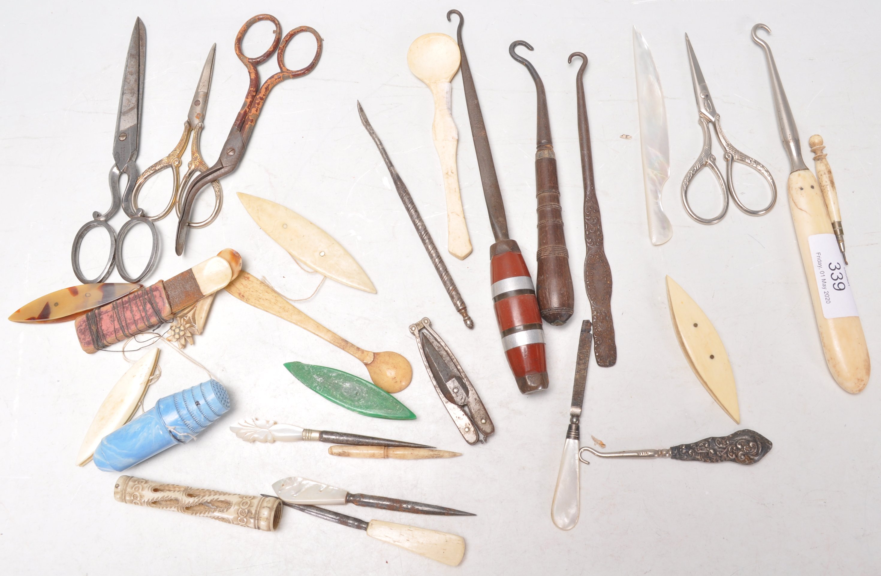 A collection of vintage and antique sewing related items to include ...