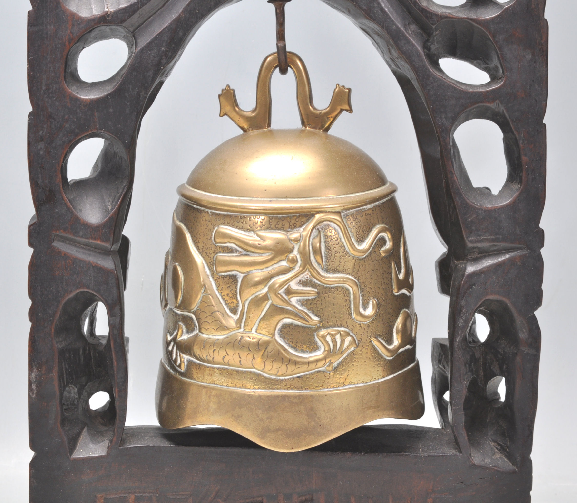 A Chinese antique prayer gong handing a carved wooden frame being ...