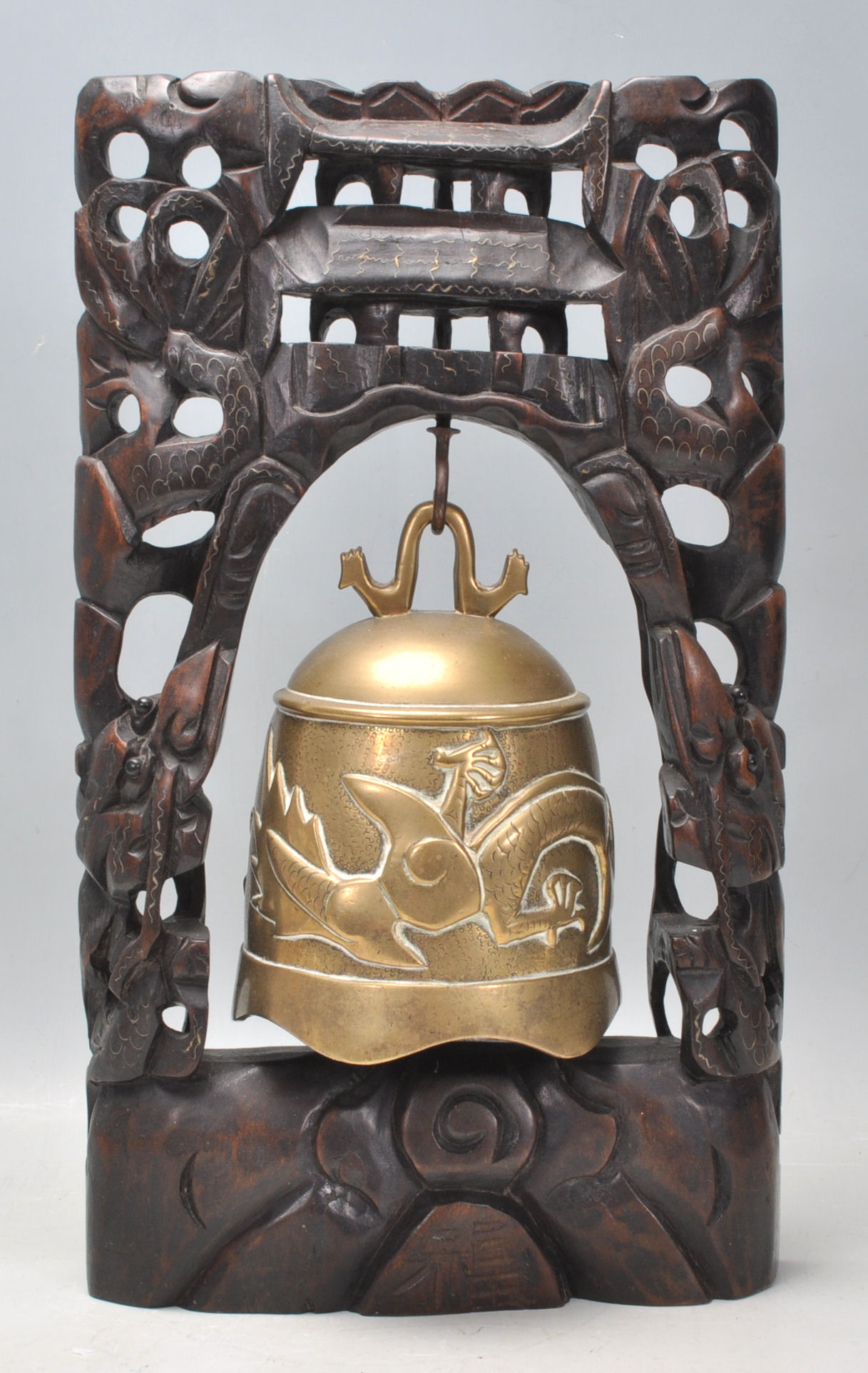 A Chinese antique prayer gong handing a carved wooden frame being ...