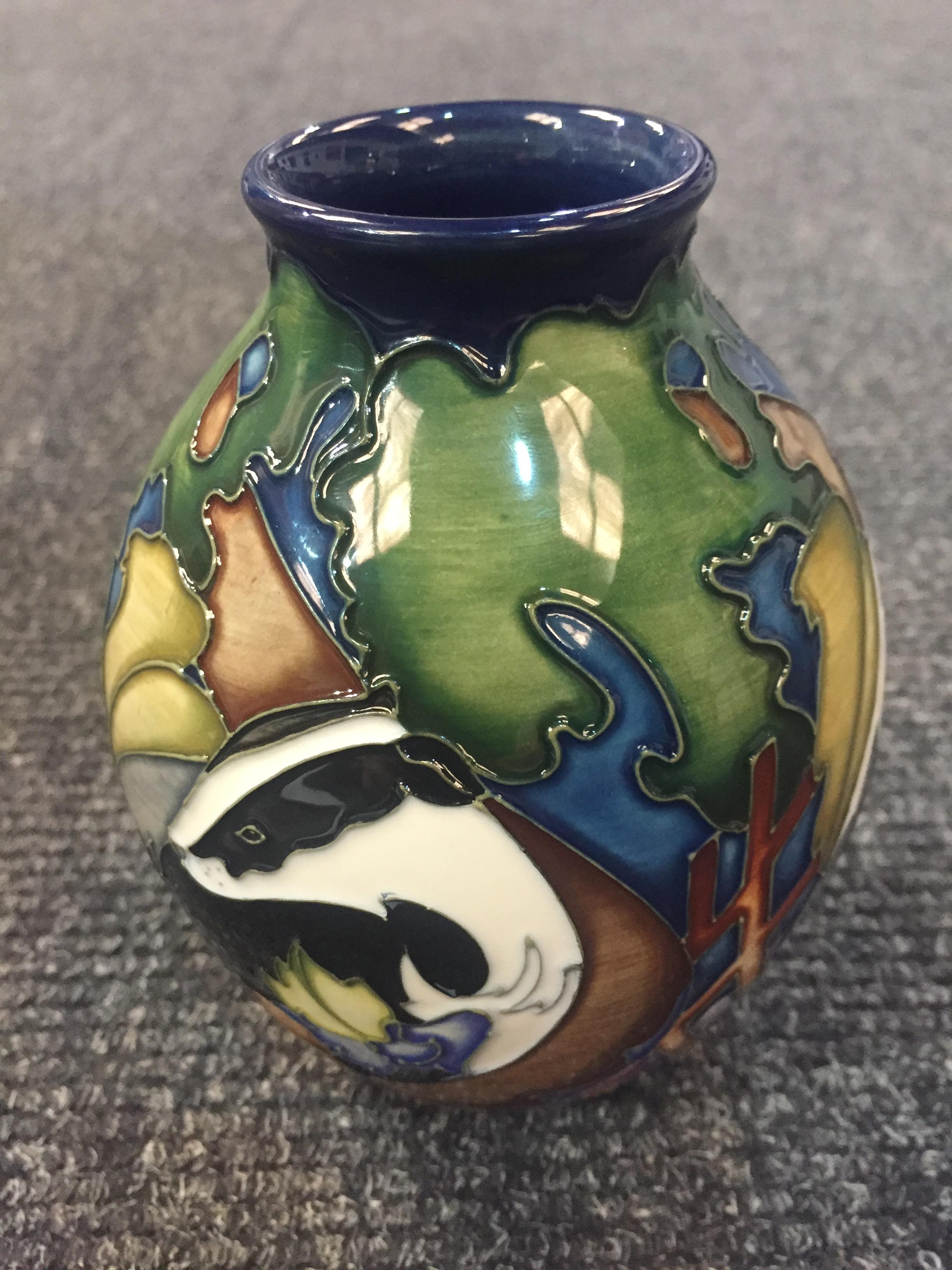 A Moorcroft Pottery vase decorated in The Sett pattern designed by ...