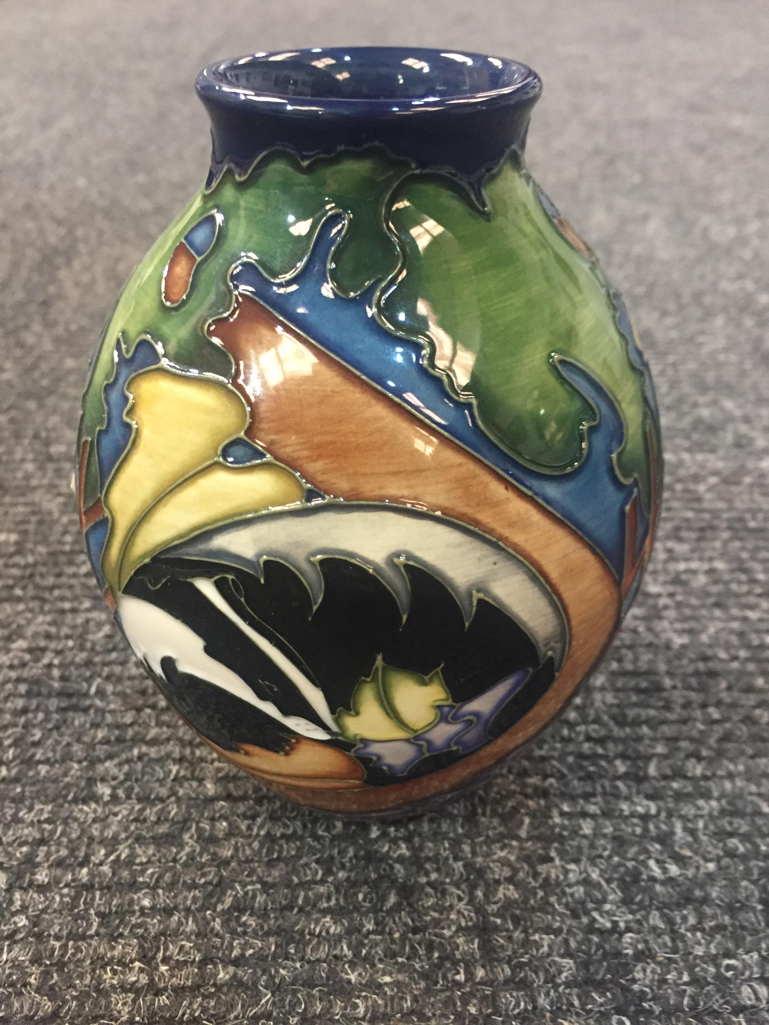 A Moorcroft Pottery vase decorated in The Sett pattern designed by ...