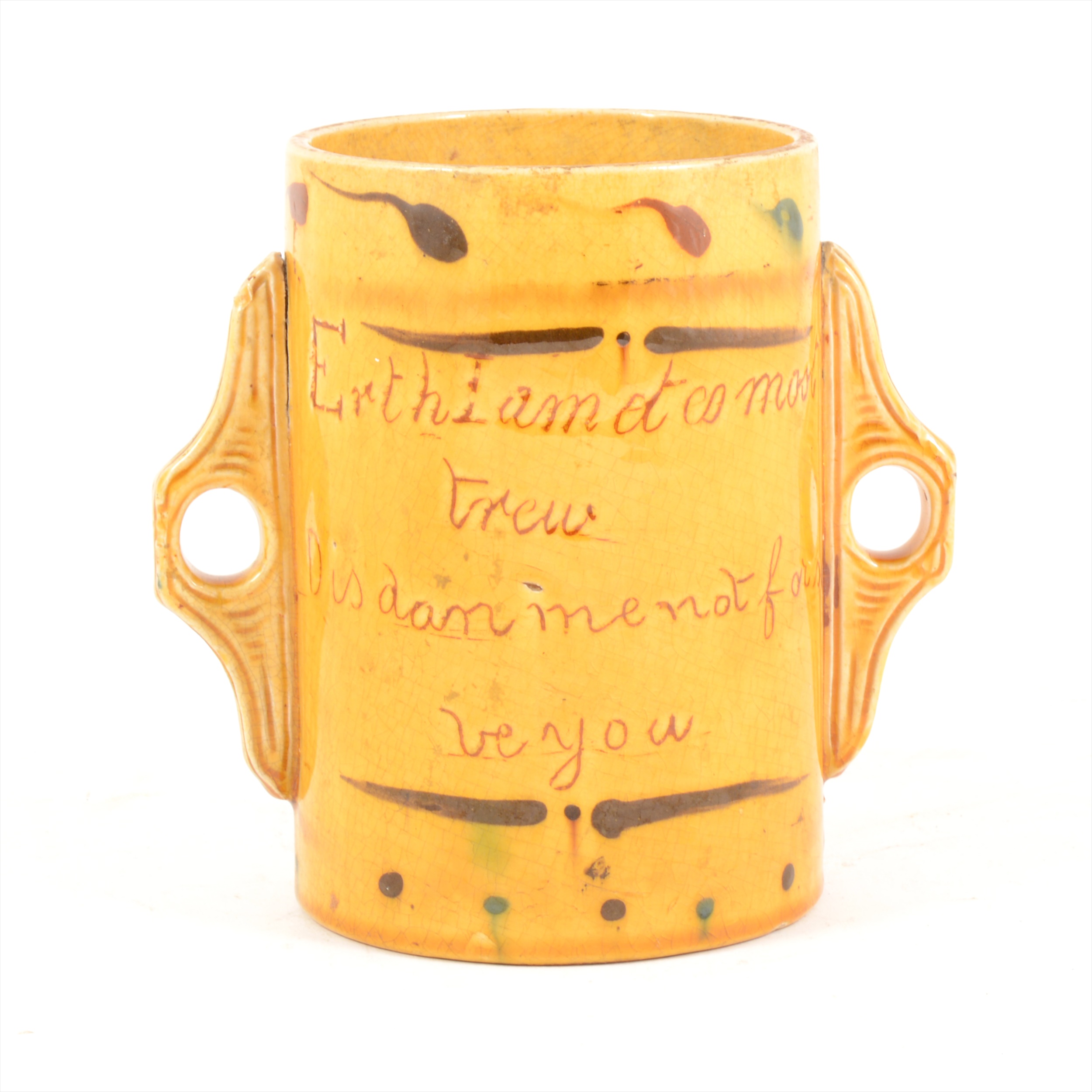 A 19th Century slipware loving cup, cylindrical body, with verse to one ...