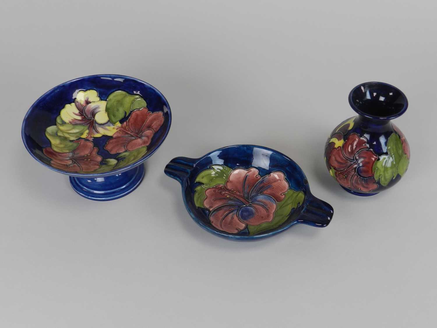 A group of Moorcroft in the 'Hibiscus' pattern (20th century ...