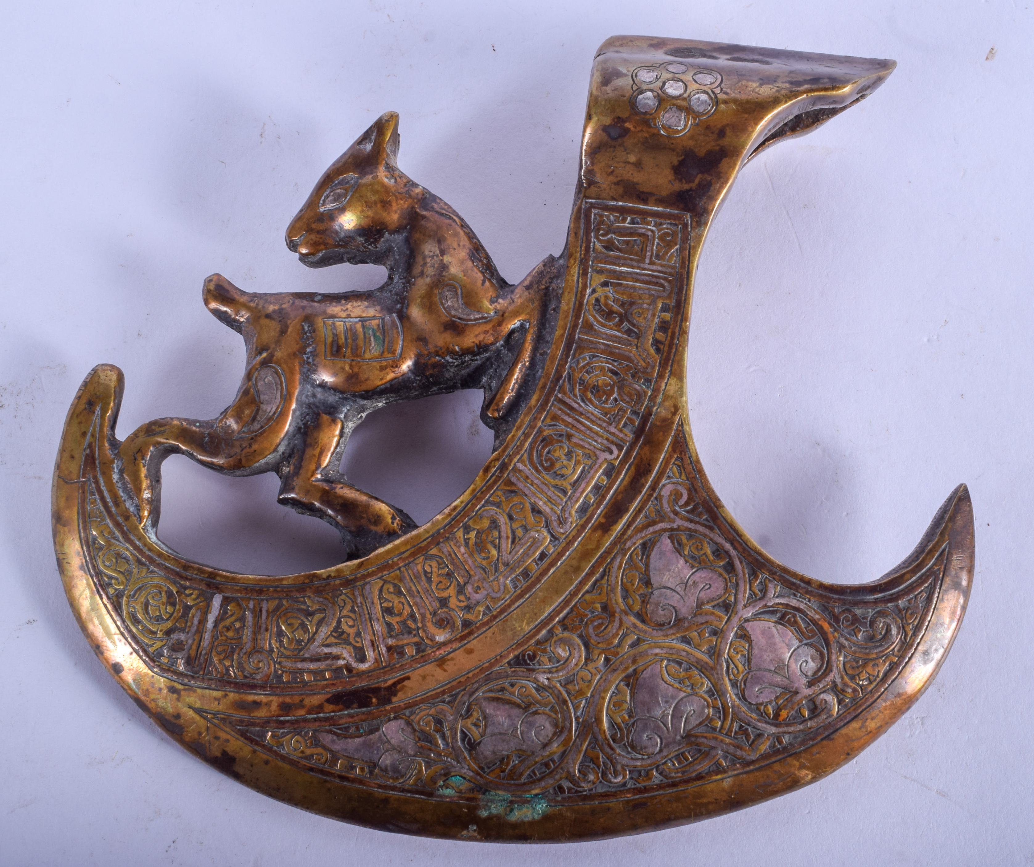 A MIDDLE EASTERN SILVER INLAID BRONZE PERSIAN AXE HEAD decorated with ...