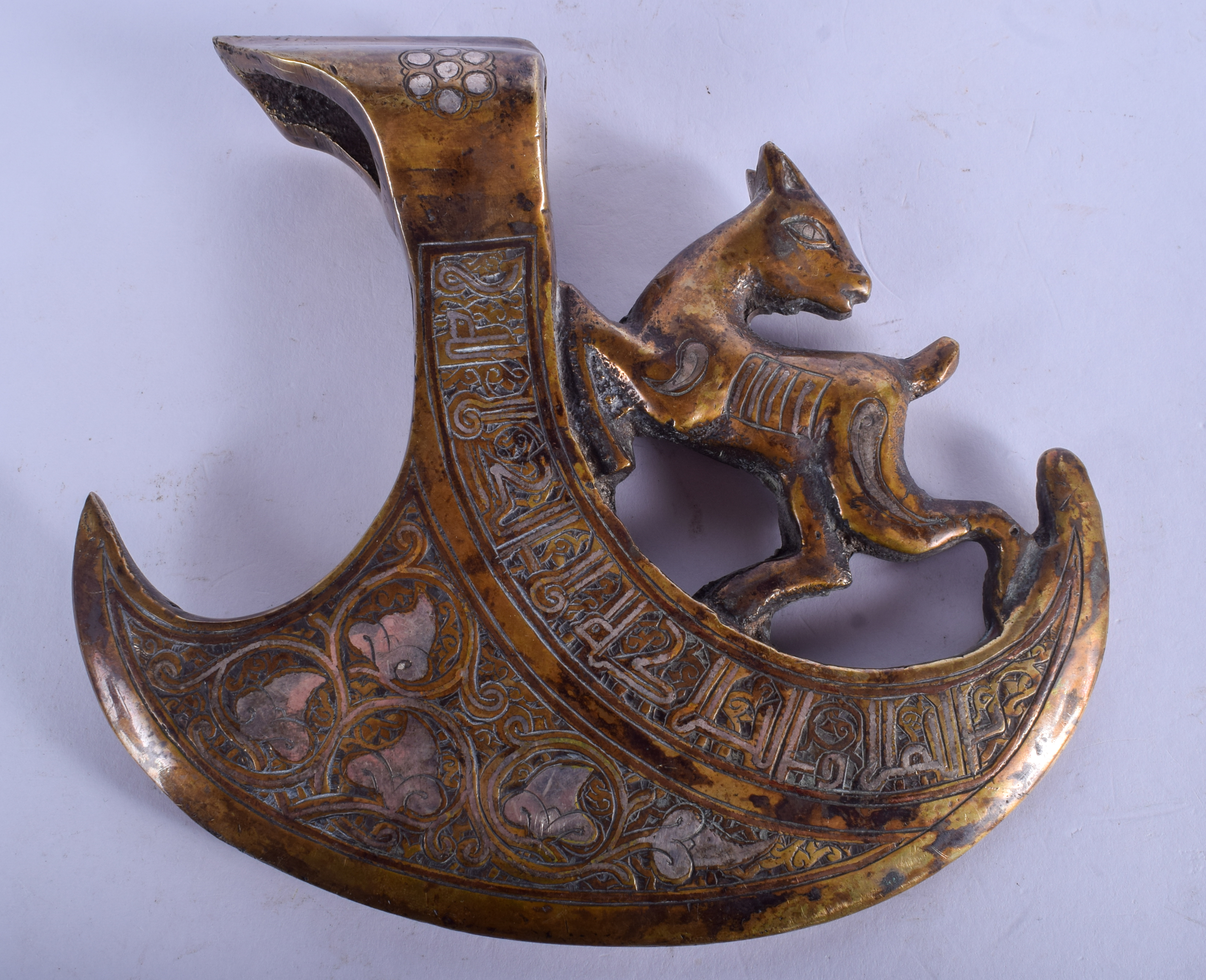 A MIDDLE EASTERN SILVER INLAID BRONZE PERSIAN AXE HEAD decorated with ...