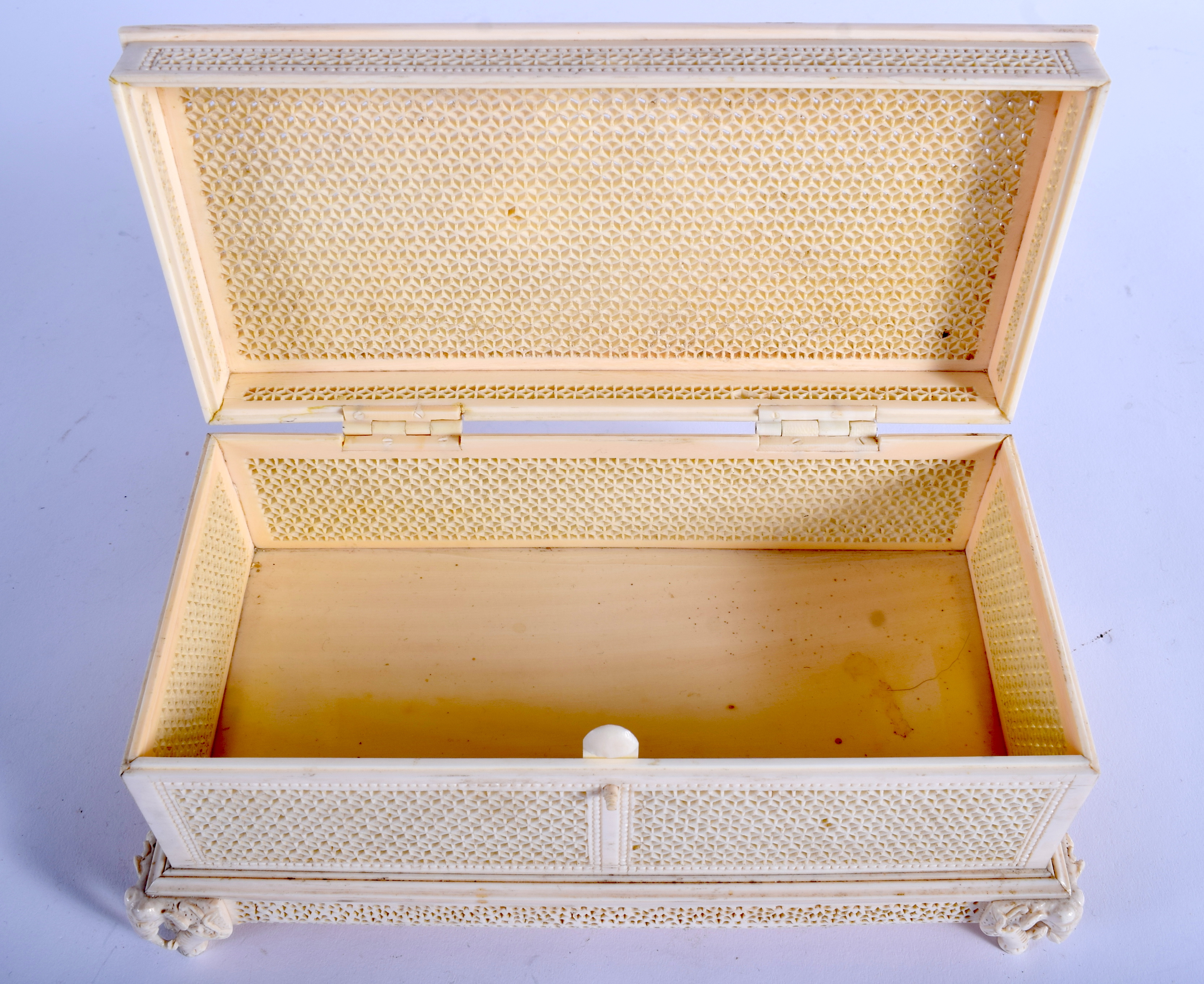 A 19TH CENTURY ANGLO INDIAN CARVED IVORY CASKET together with a pair of ...