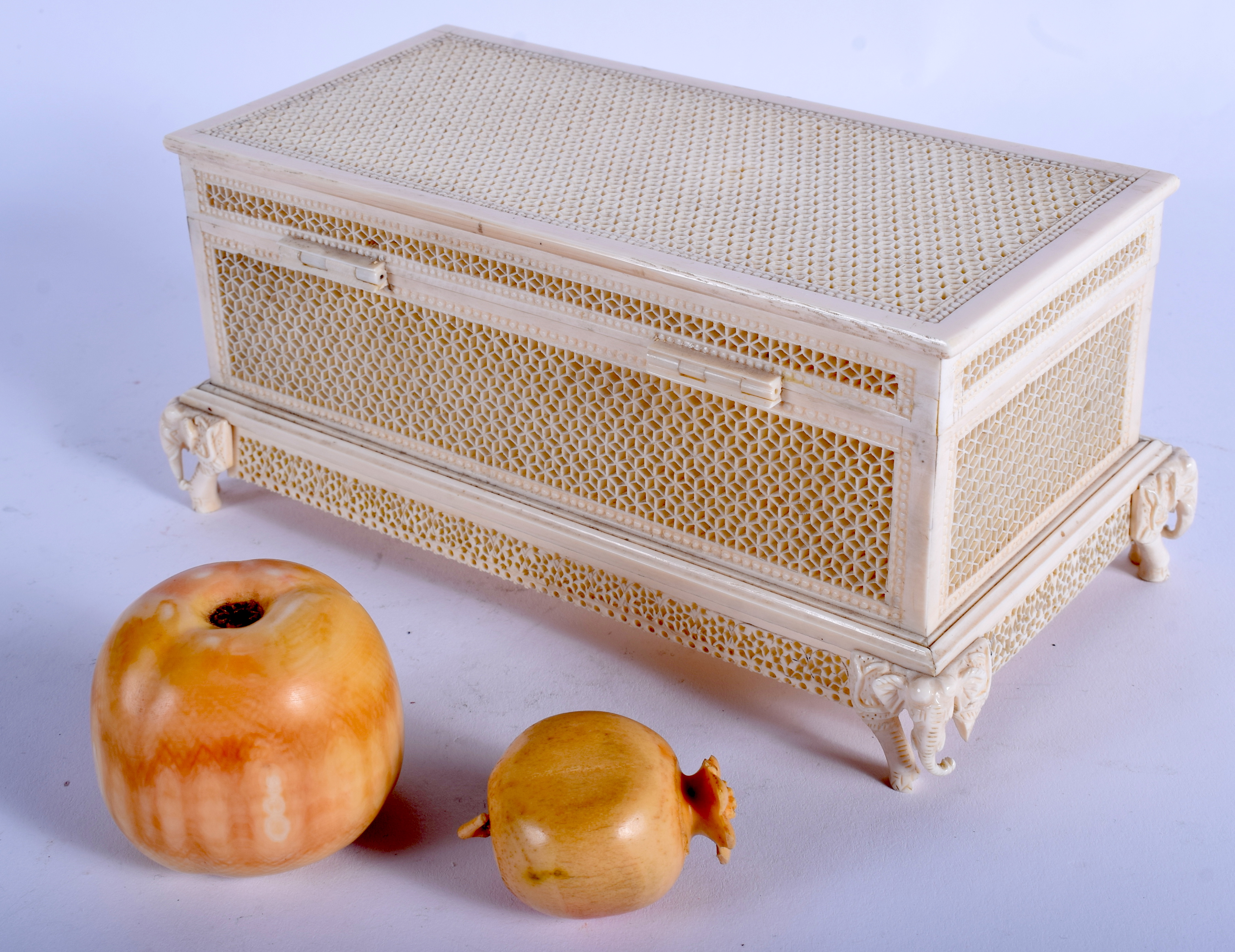 A 19TH CENTURY ANGLO INDIAN CARVED IVORY CASKET together with a pair of ...