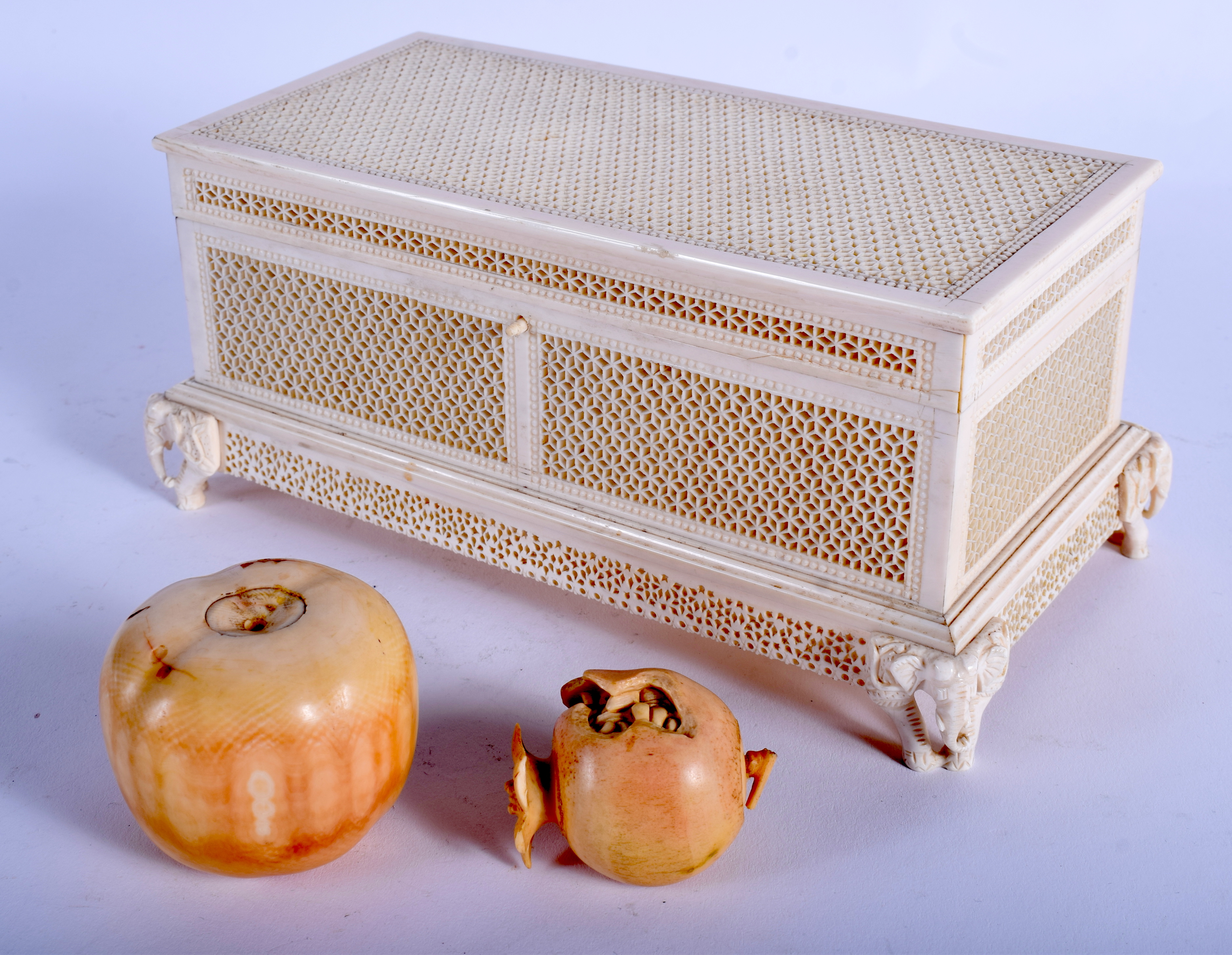 A 19TH CENTURY ANGLO INDIAN CARVED IVORY CASKET together with a pair of ...