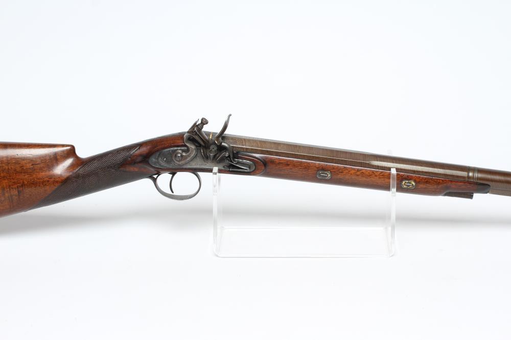 A FLINTLOCK SPORTING GUN by Fisher of London, the 32" barrel octagonal ...