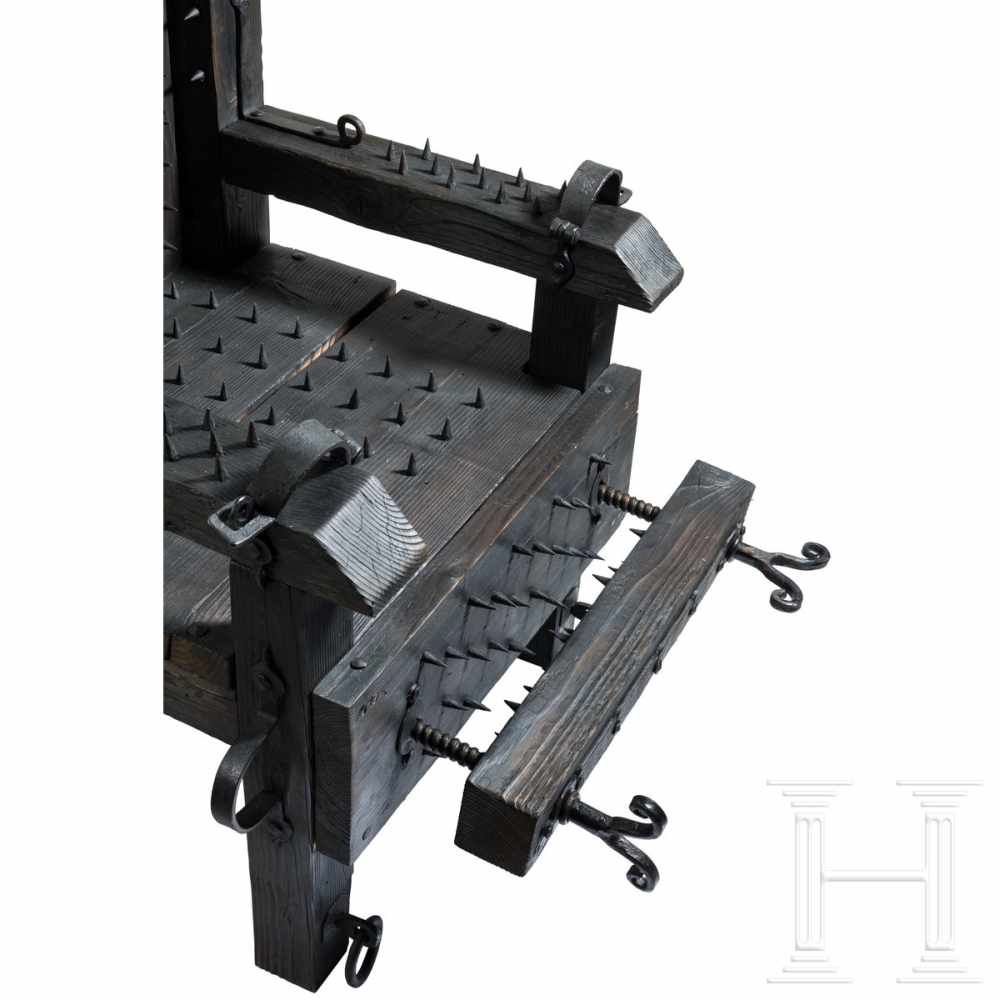 A torture chair, modern reproduction in the style of the 16th/17th ...