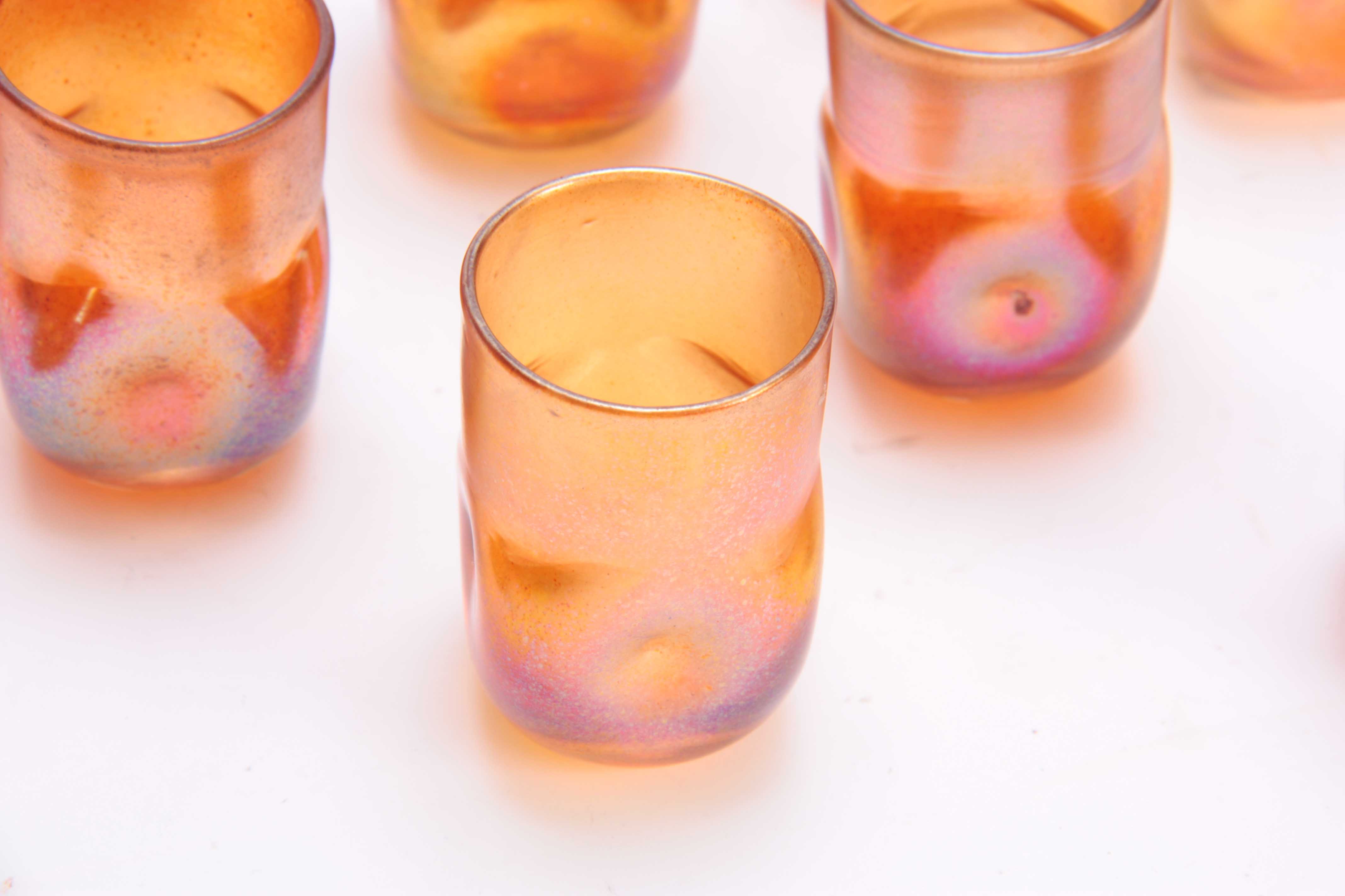 A SET OF TEN TIFFANY FAVRILE SHOT GLASSES with square dimple bodies and ...