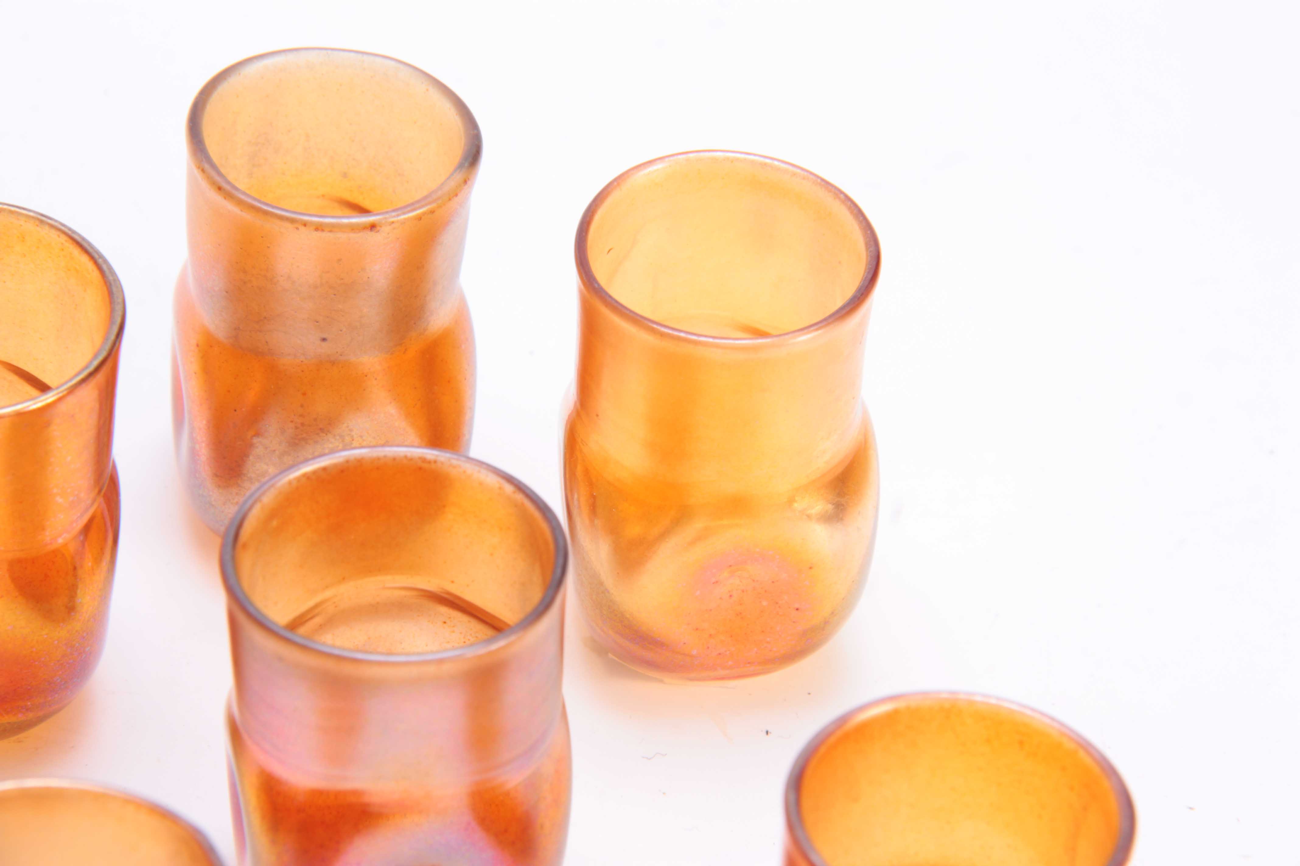 A SET OF TEN TIFFANY FAVRILE SHOT GLASSES with square dimple bodies and ...