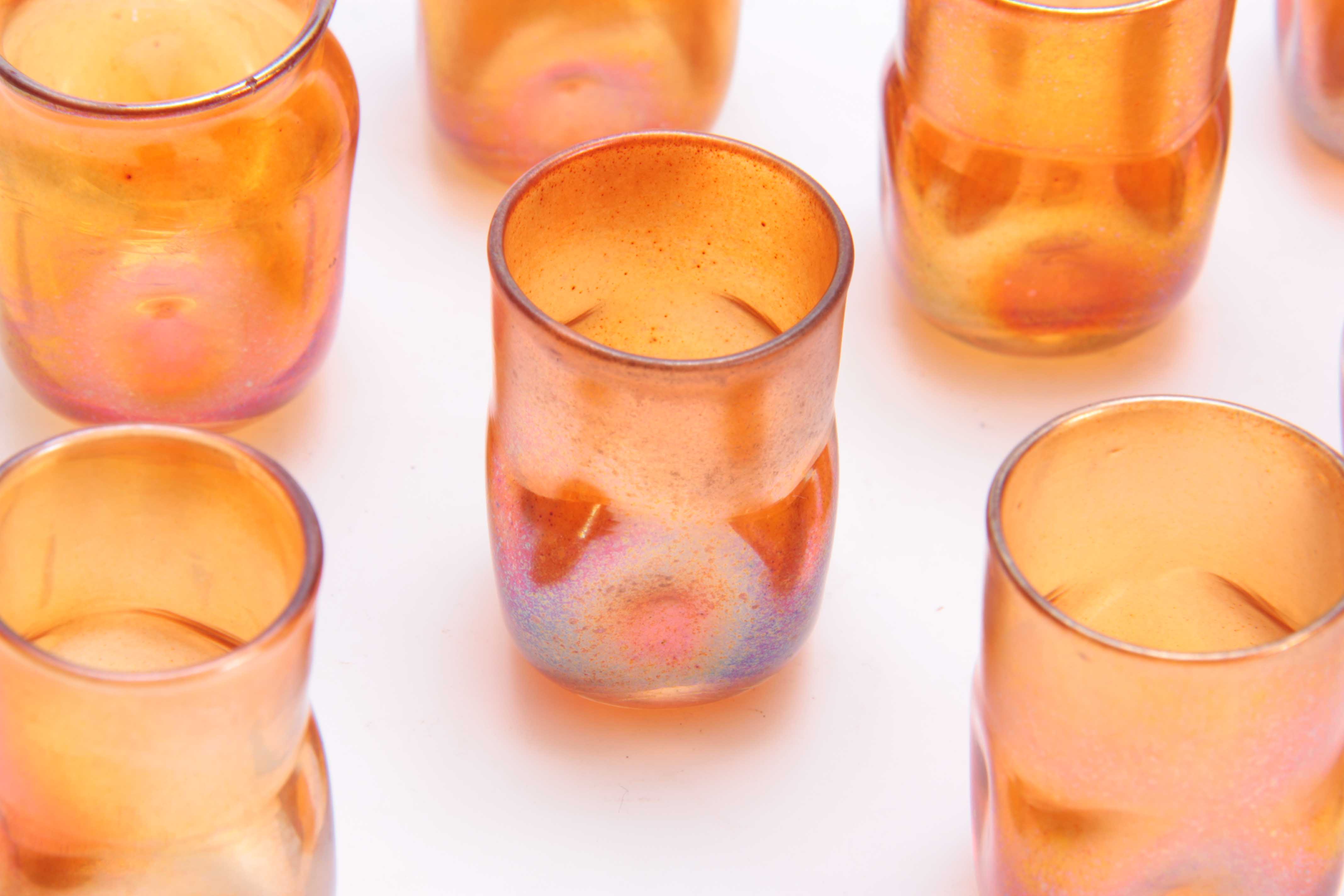 A SET OF TEN TIFFANY FAVRILE SHOT GLASSES with square dimple bodies and ...