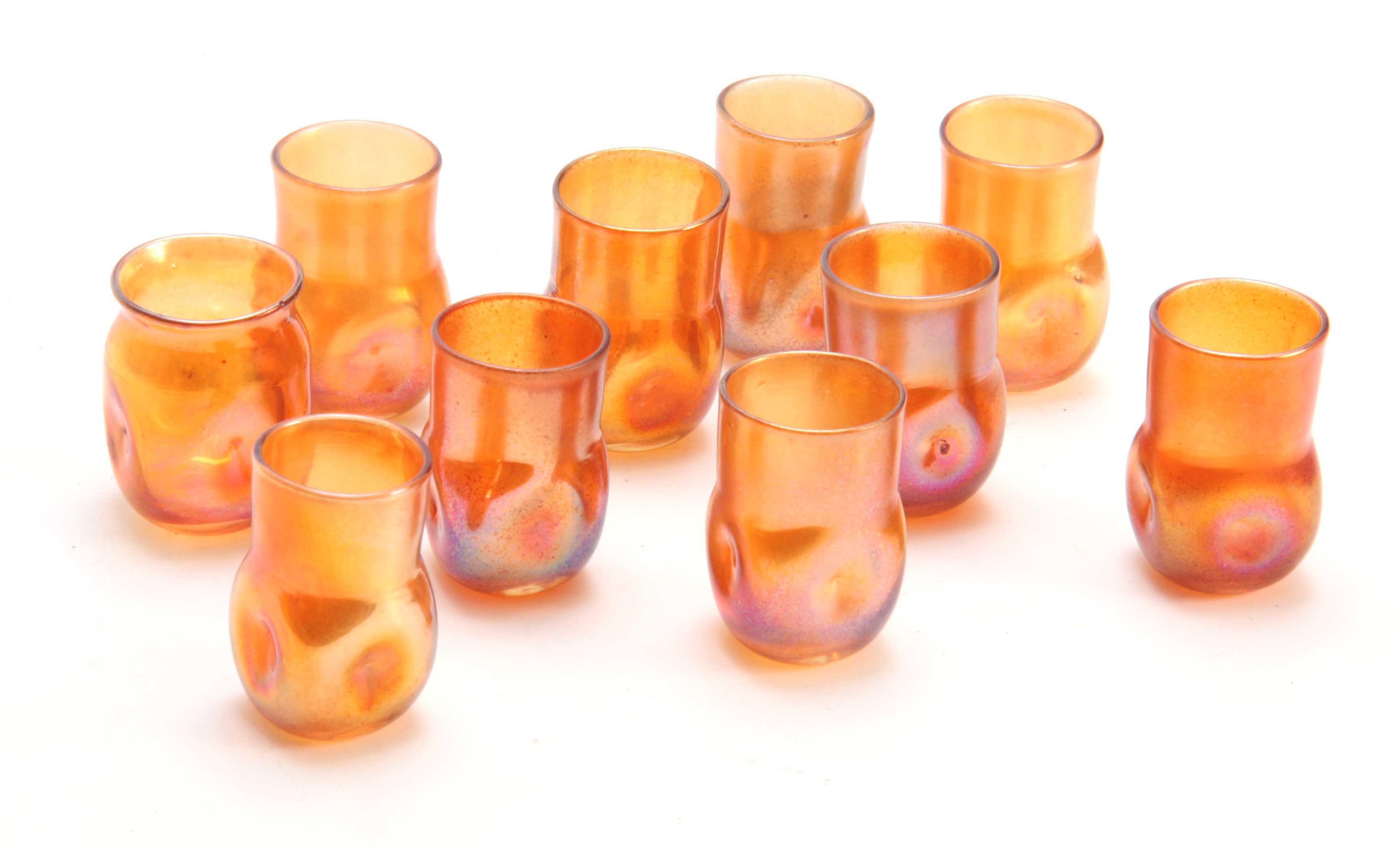 A SET OF TEN TIFFANY FAVRILE SHOT GLASSES with square dimple bodies and ...
