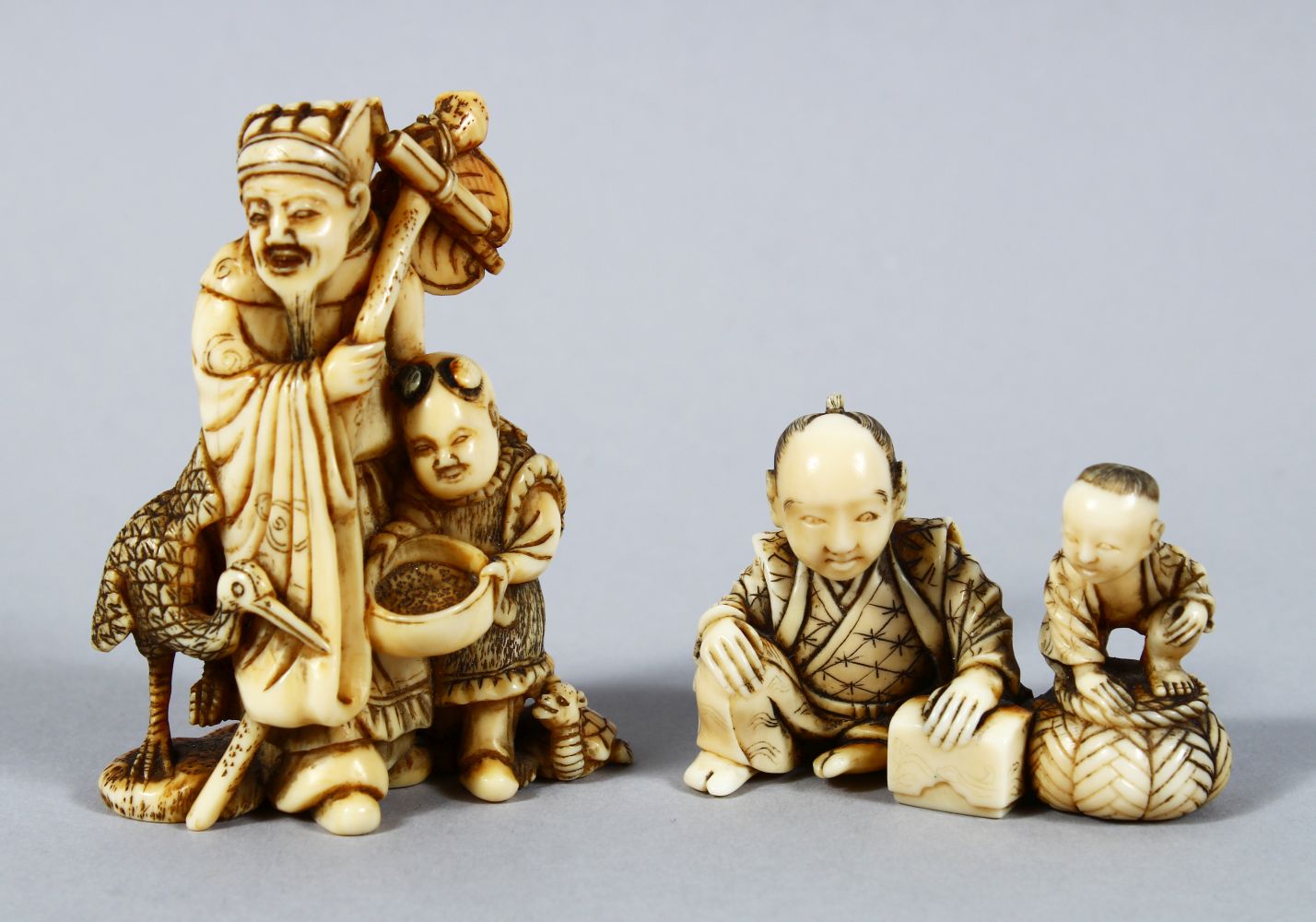 TWO JAPANESE MEIJI PERIOD CARVED IVORY OKIMONO / NETSUKE, the first ...