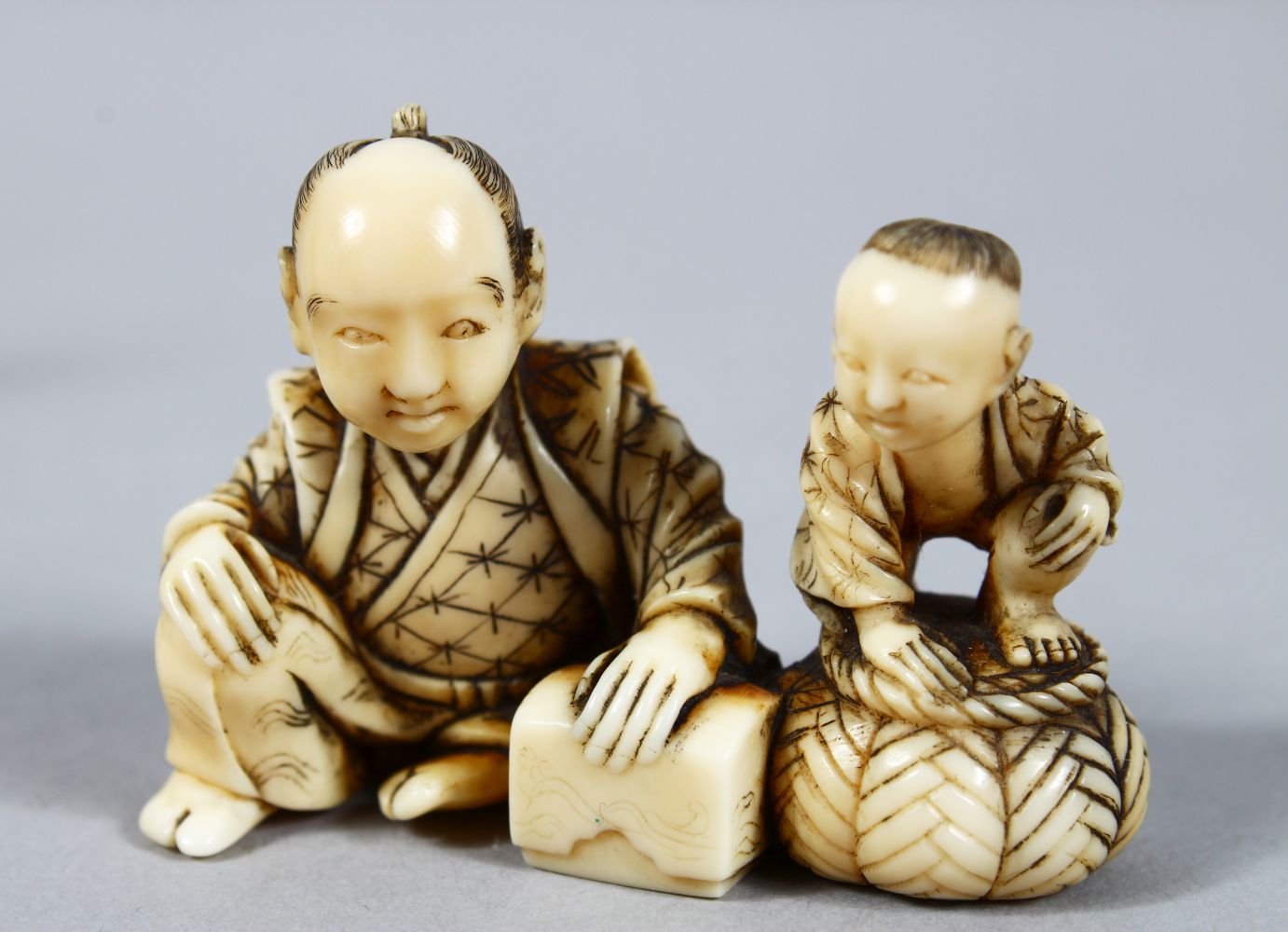 TWO JAPANESE MEIJI PERIOD CARVED IVORY OKIMONO / NETSUKE, the first ...
