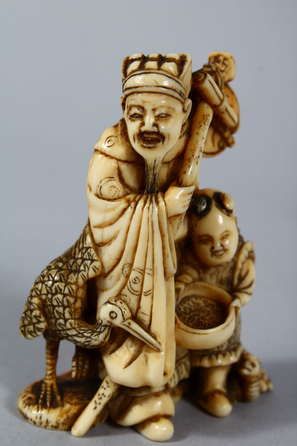 TWO JAPANESE MEIJI PERIOD CARVED IVORY OKIMONO / NETSUKE, the first ...