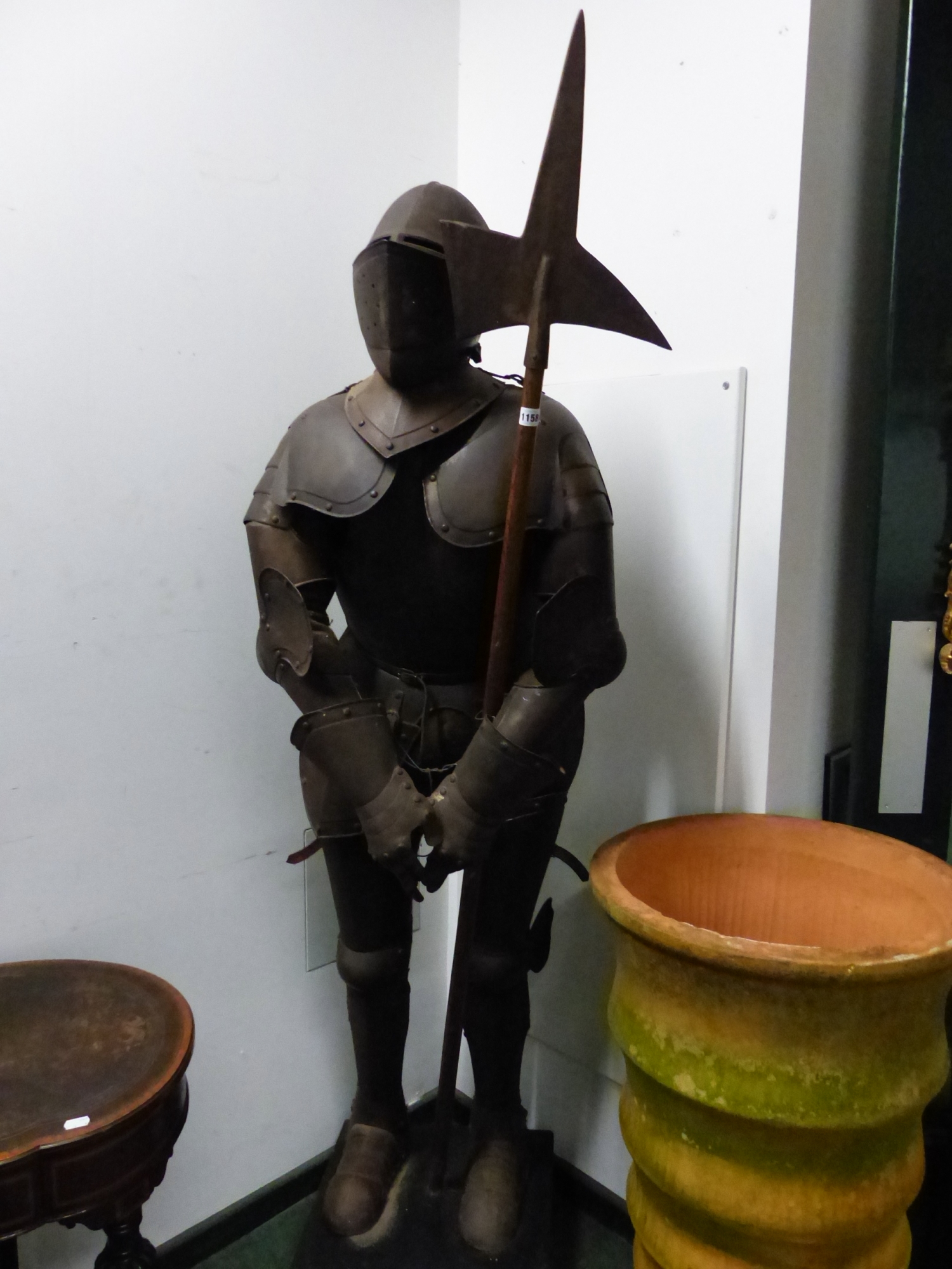 A REPRODUCTION SUIT OF MEDIAEVAL ARMOUR WORN BY A LIFE SIZE MANNEQUIN ...