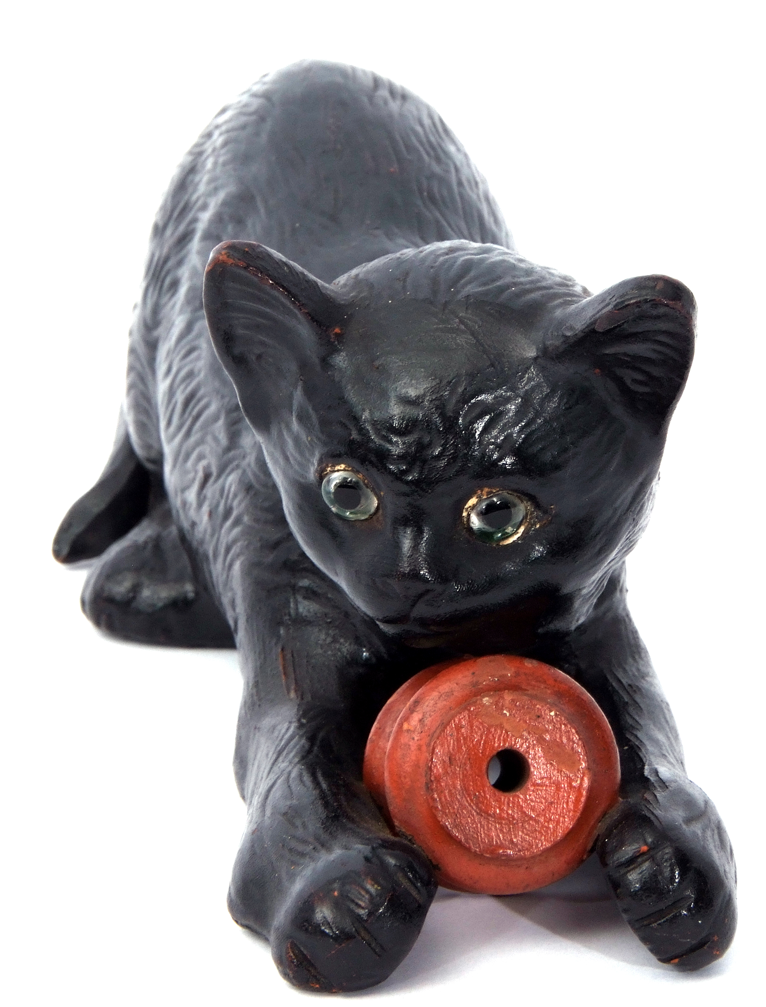 Unusual Bretby pottery model of a cat with glass eyes holding a reel of ...