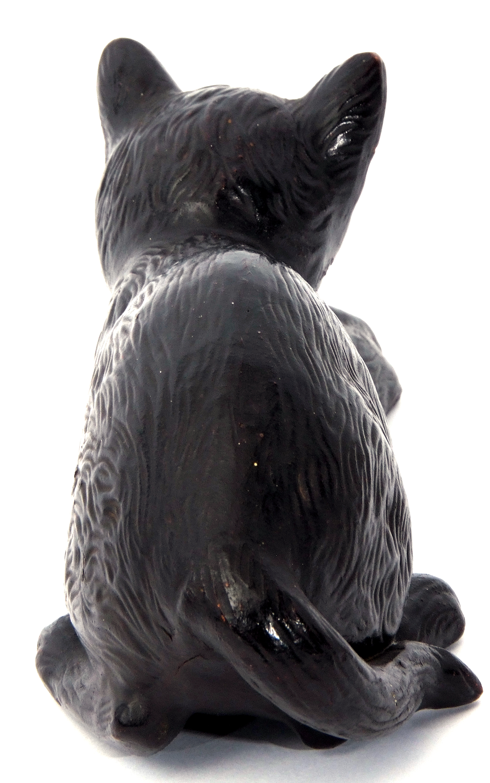 Unusual Bretby pottery model of a cat with glass eyes holding a reel of ...