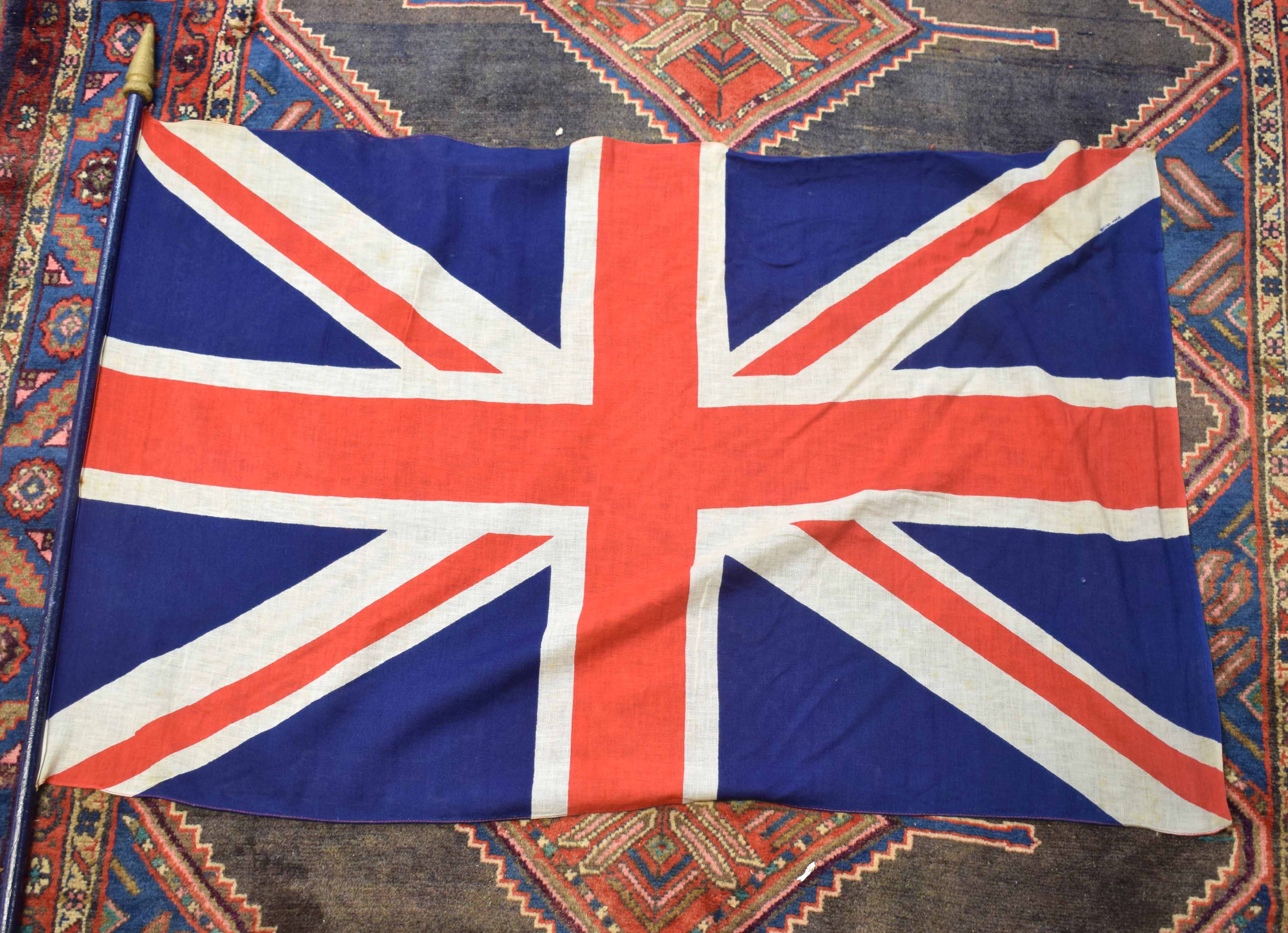 Two Union Jack flags, gilded pointers and dark blue stems, 157cm long