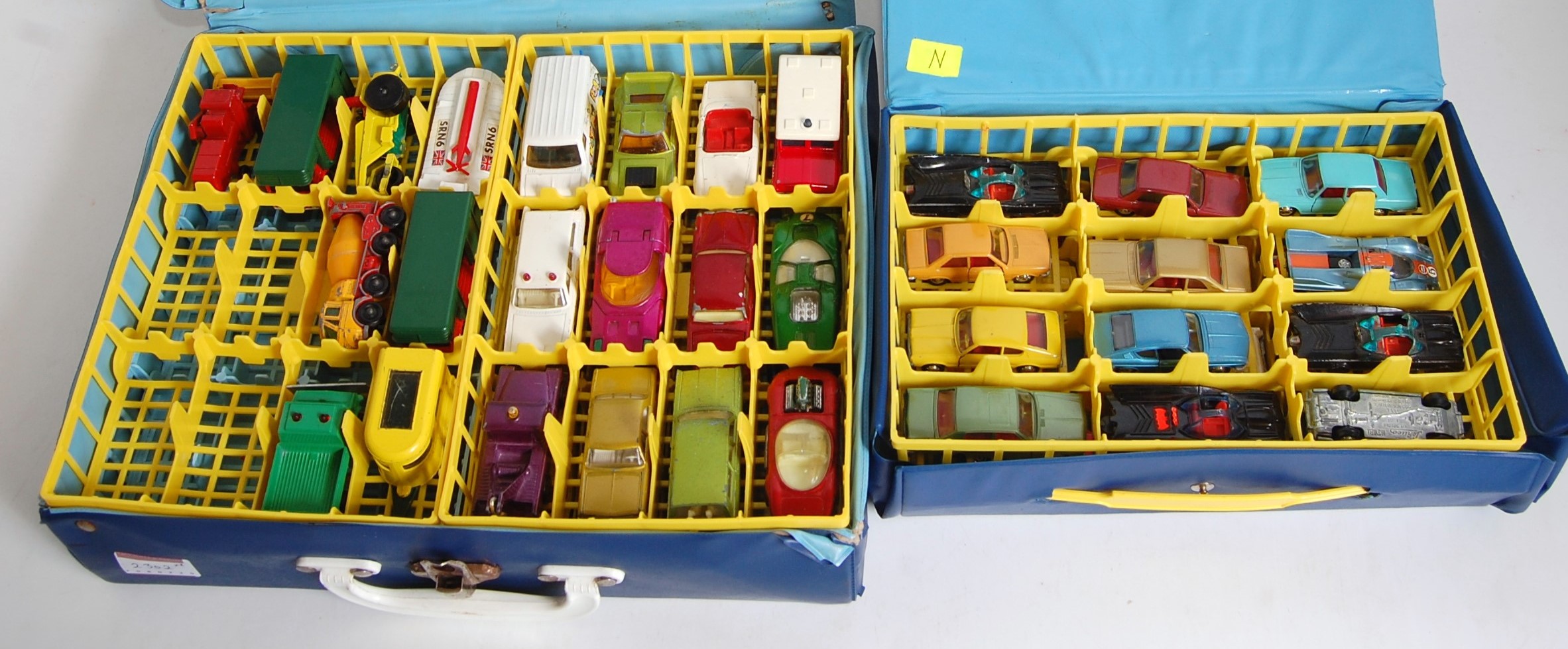 Two Matchbox 1/75 series carry cases containing a quantity of various ...