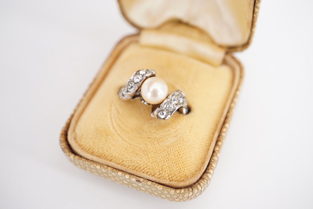 A vintage white-metal Ciro faux pearl and paste set cocktail ring, in ...