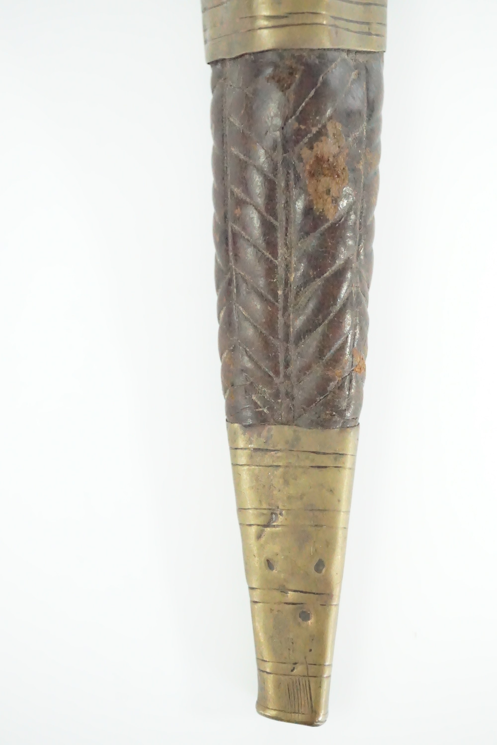 An 18th Century Scottish dirk scabbard, of brown hide bearing tooled ...
