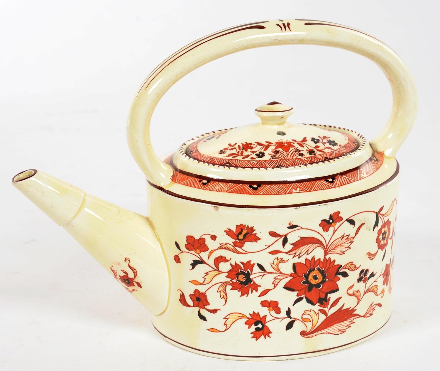 A WEDGWOOD OVAL QUEENSWARE TEAPOT AND COVER, DECORATED IN RED AND BLACK ...