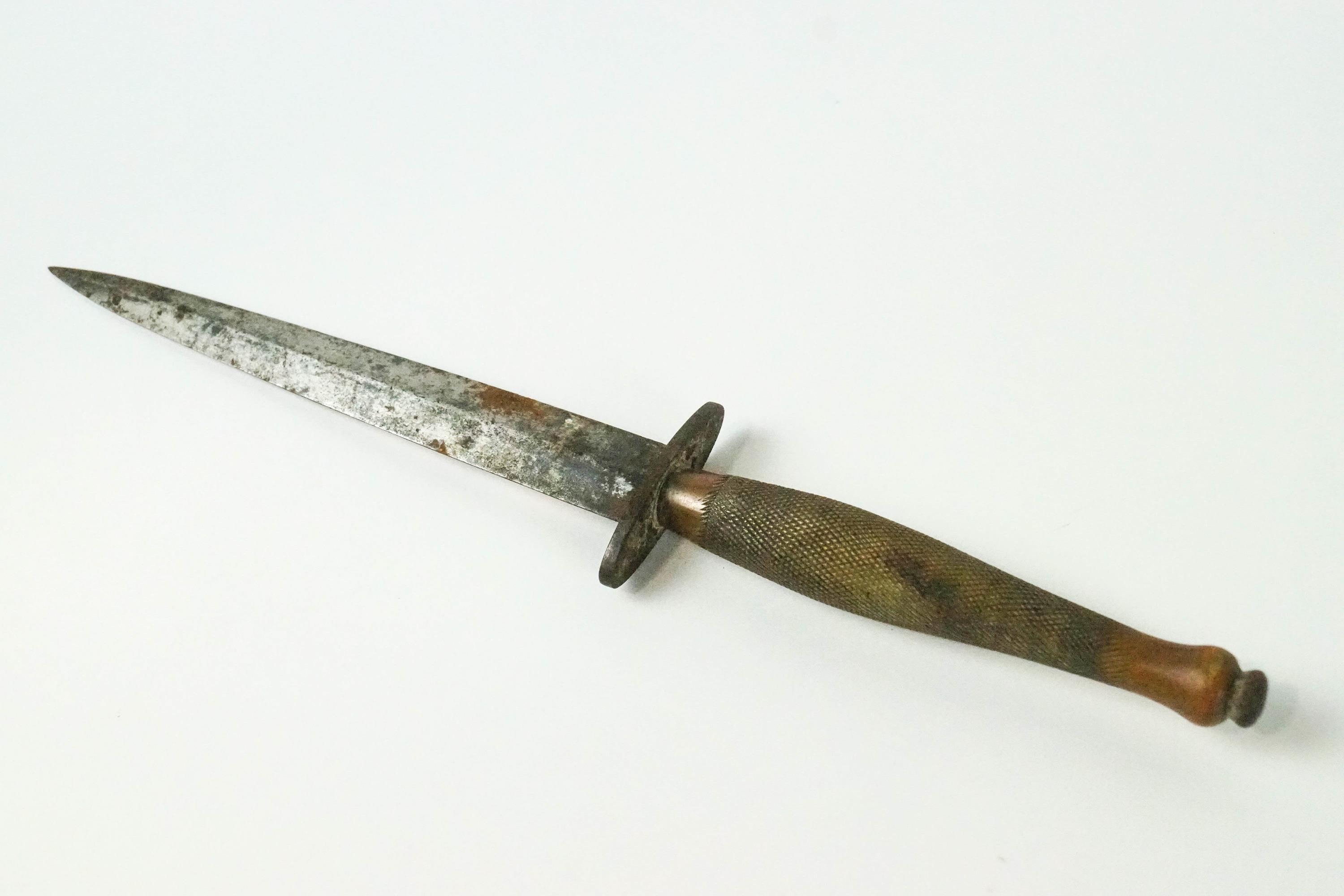 A Commando dagger, with weighted copper handle, 29.5cm long