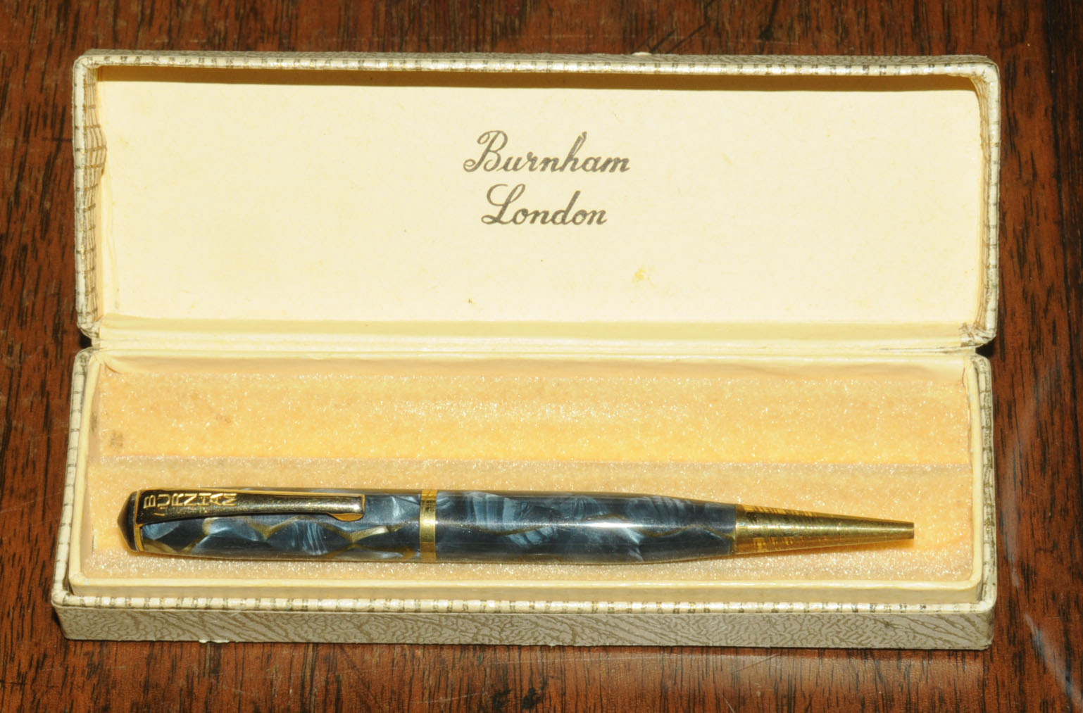 A collection of vintage fountain pens, including Burnham propelling ...
