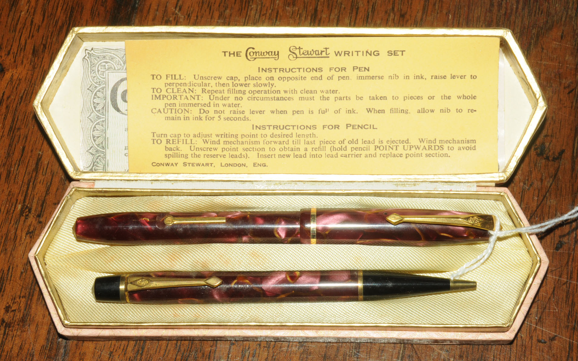A collection of vintage fountain pens, including Burnham propelling ...