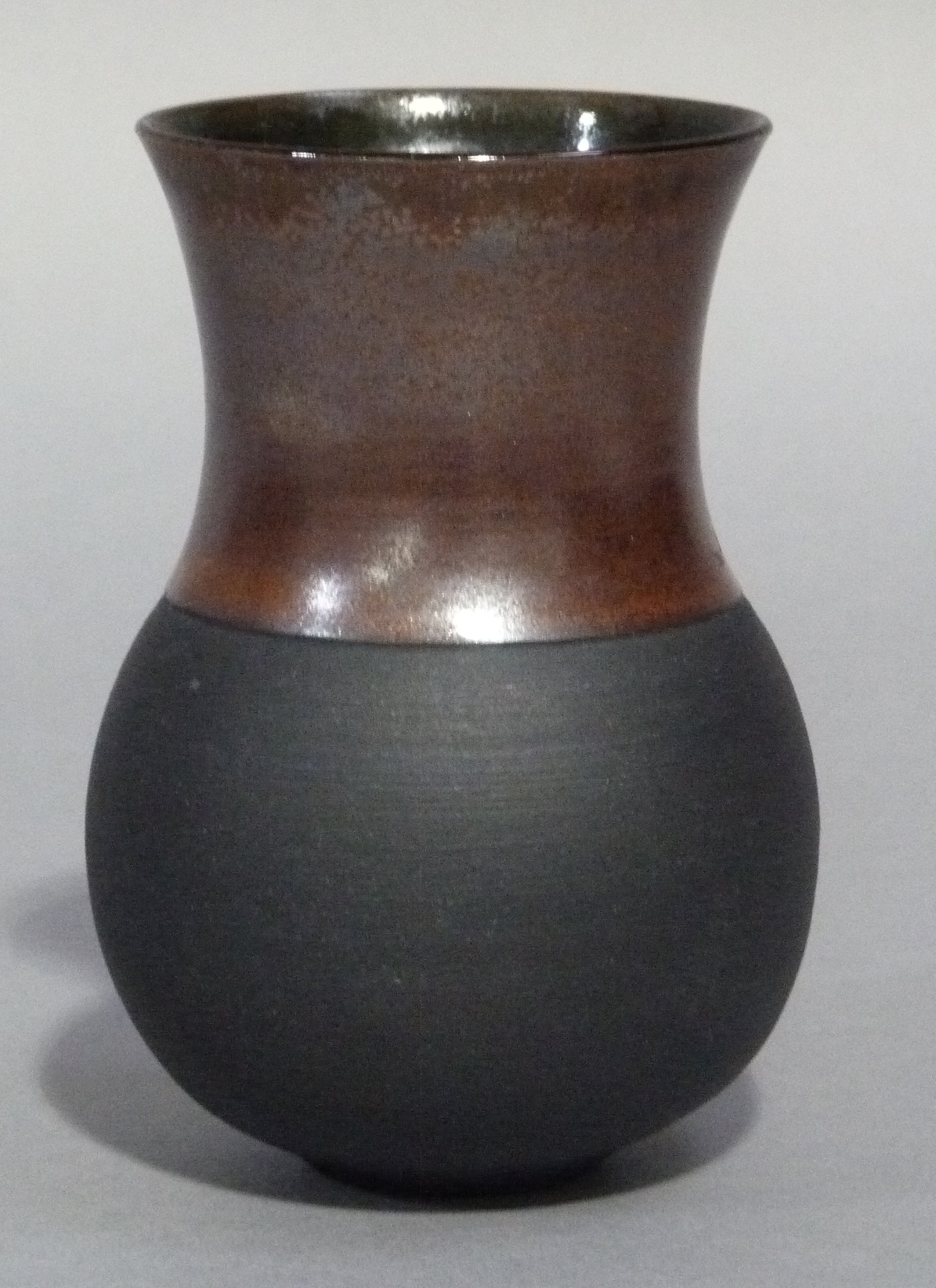 Dan Arbeid - A studio pottery vase, the baluster body with black ...