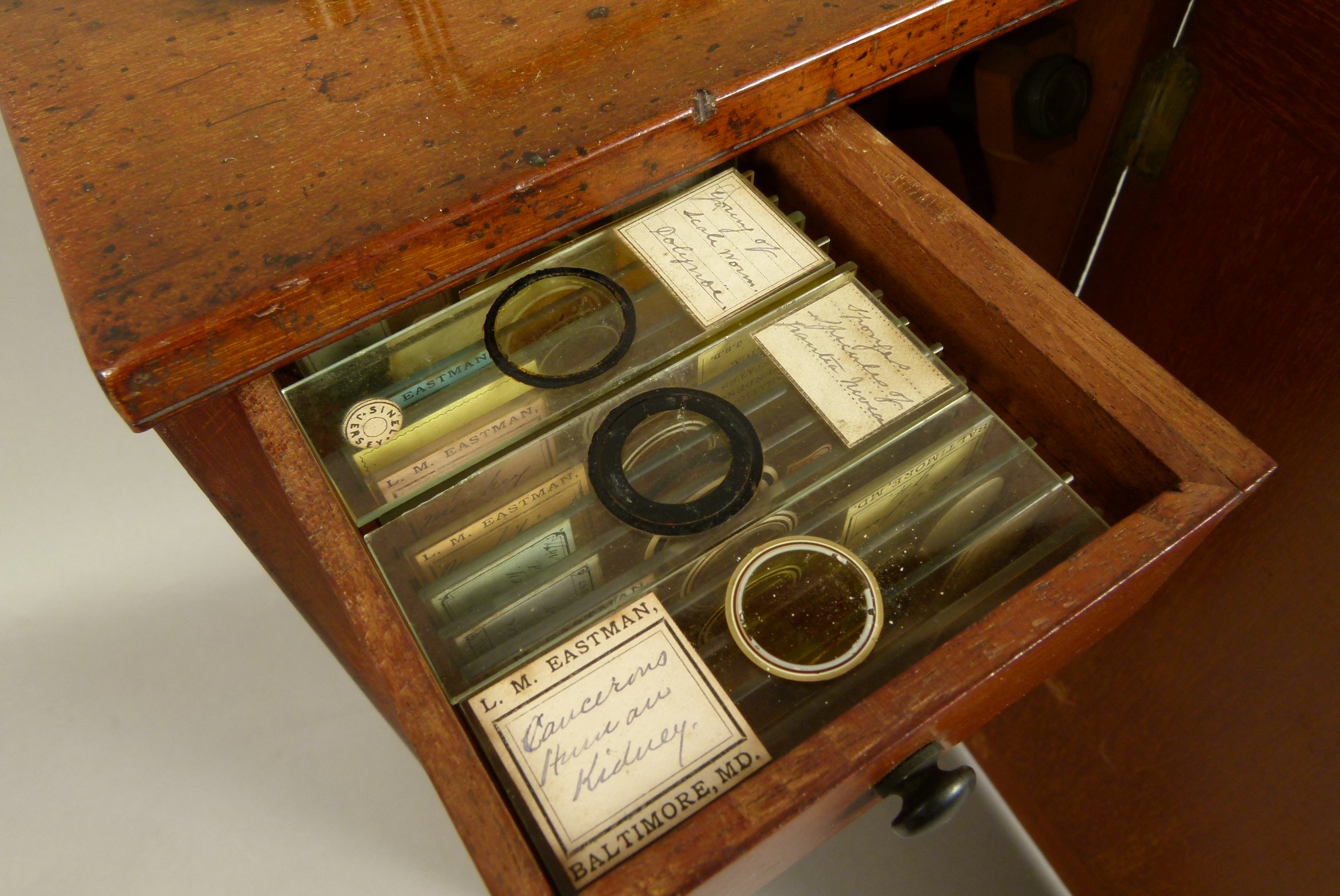 A 19TH CENTURY BRASS MICROSCOPE BY C. BAKER OF LONDON, complete with ...