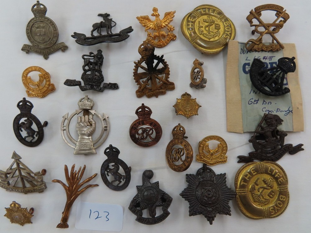 Twenty-four WWI / WWII British Army regimental cap badges