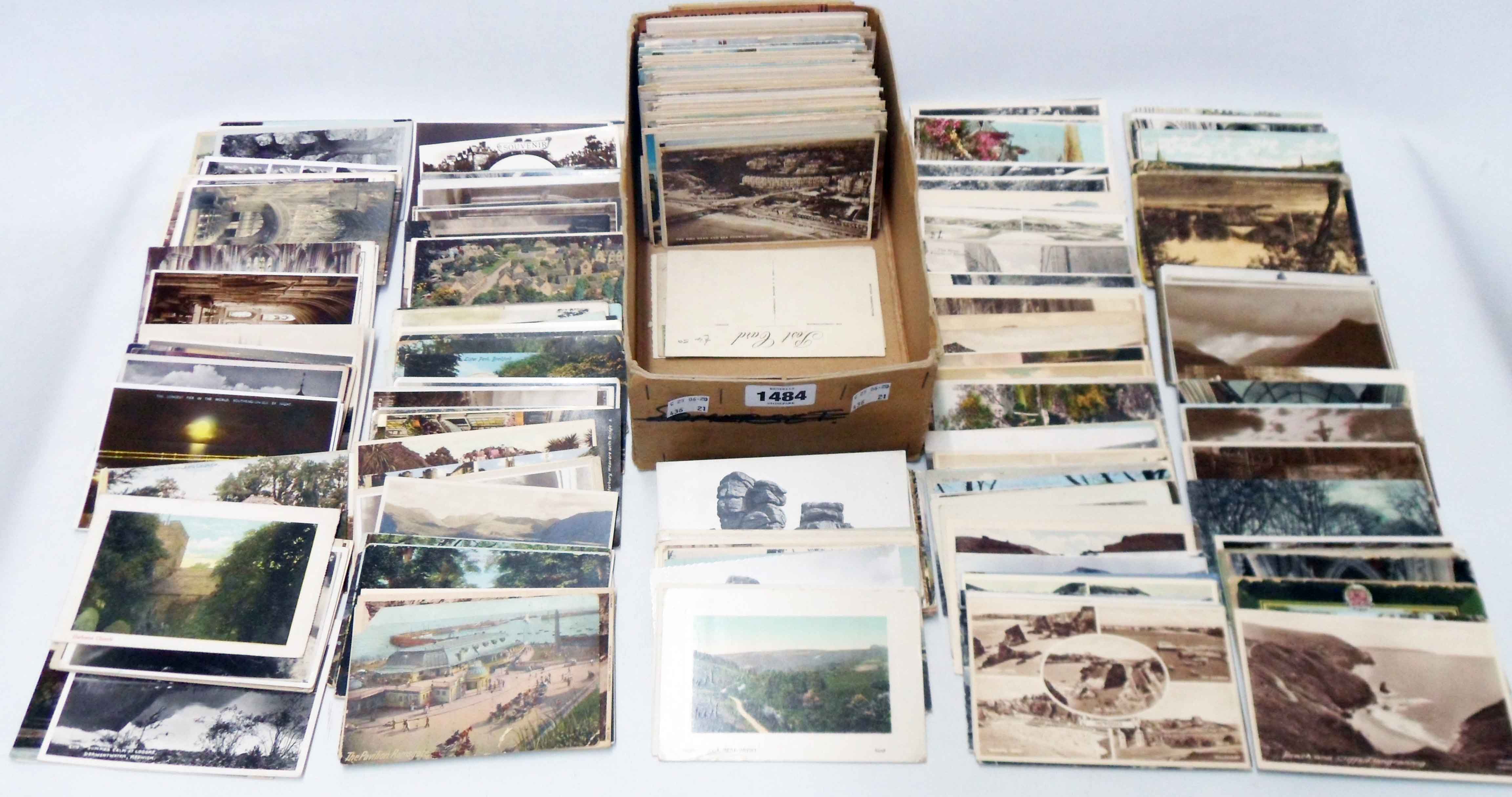 A box containing a collection of of 400 old postcards