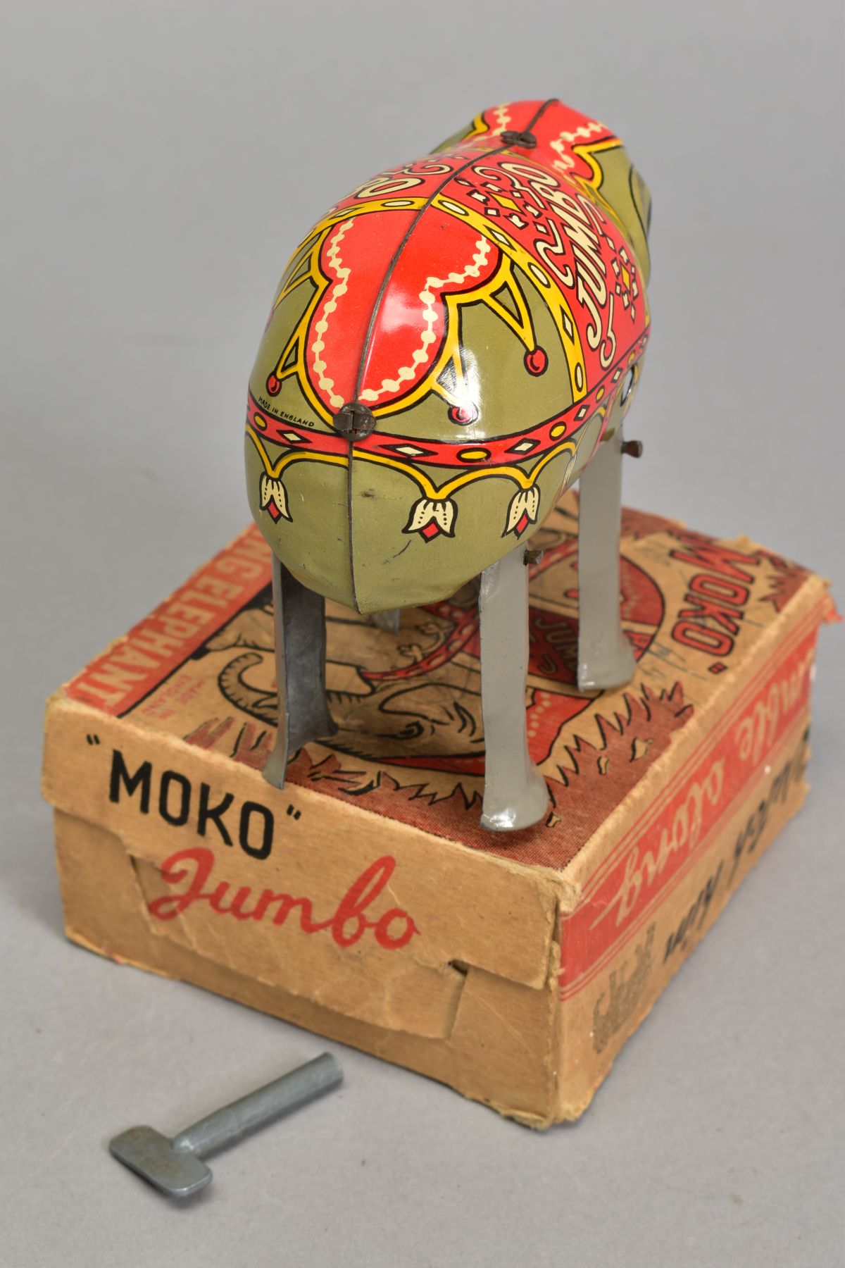 A BOXED MOKO TINPLATE CLOCKWORK JUMBO THE WALKING ELEPHANT, grey with ...
