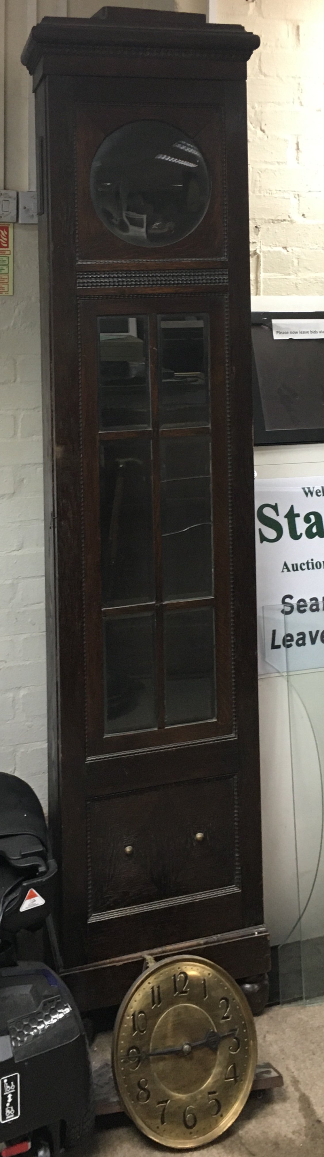 A long case clock in need of restoration, with weights and mechanism ...