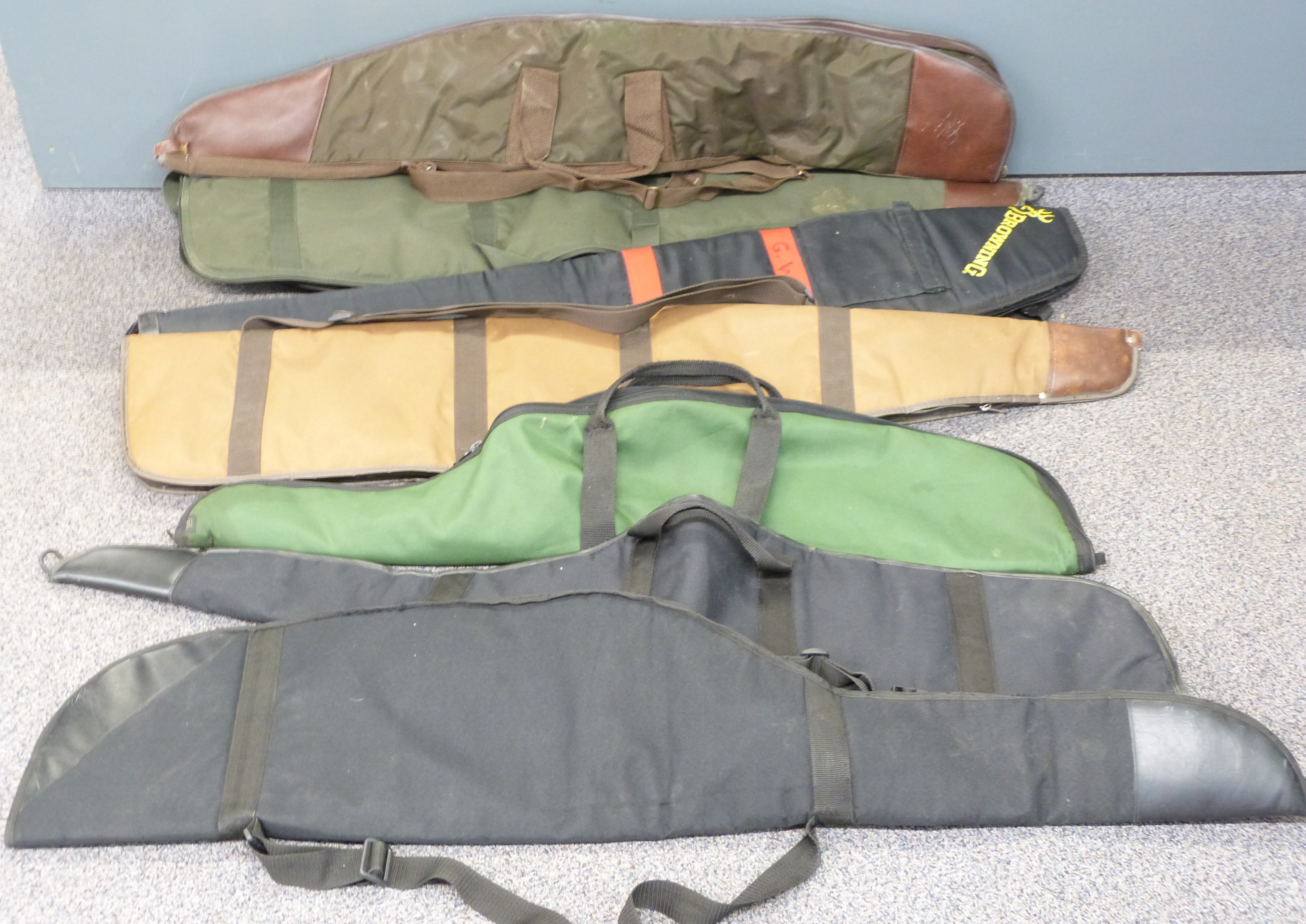 Seven padded shotgun or rifle slips including Browning, Napier and ...