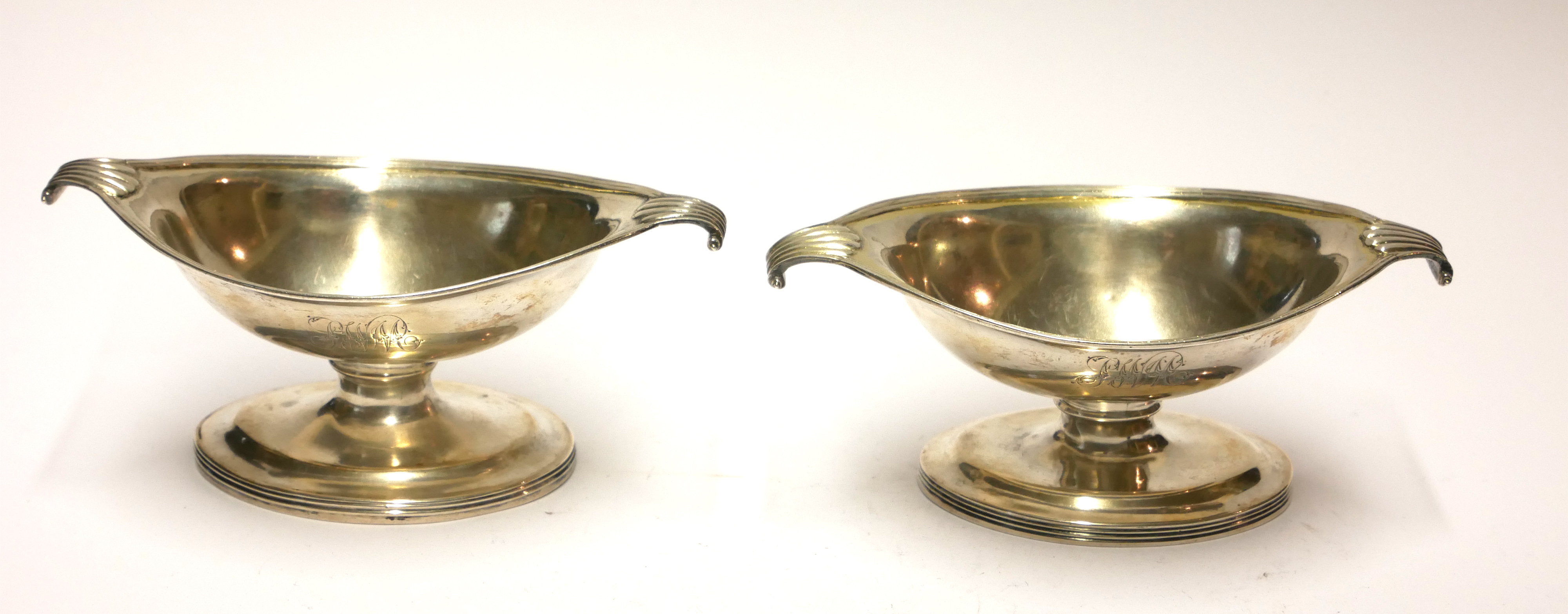 A PAIR OF GEORGIAN SCOTTISH SILVER NAVETTE FORM SALTSWith twin reeded ...