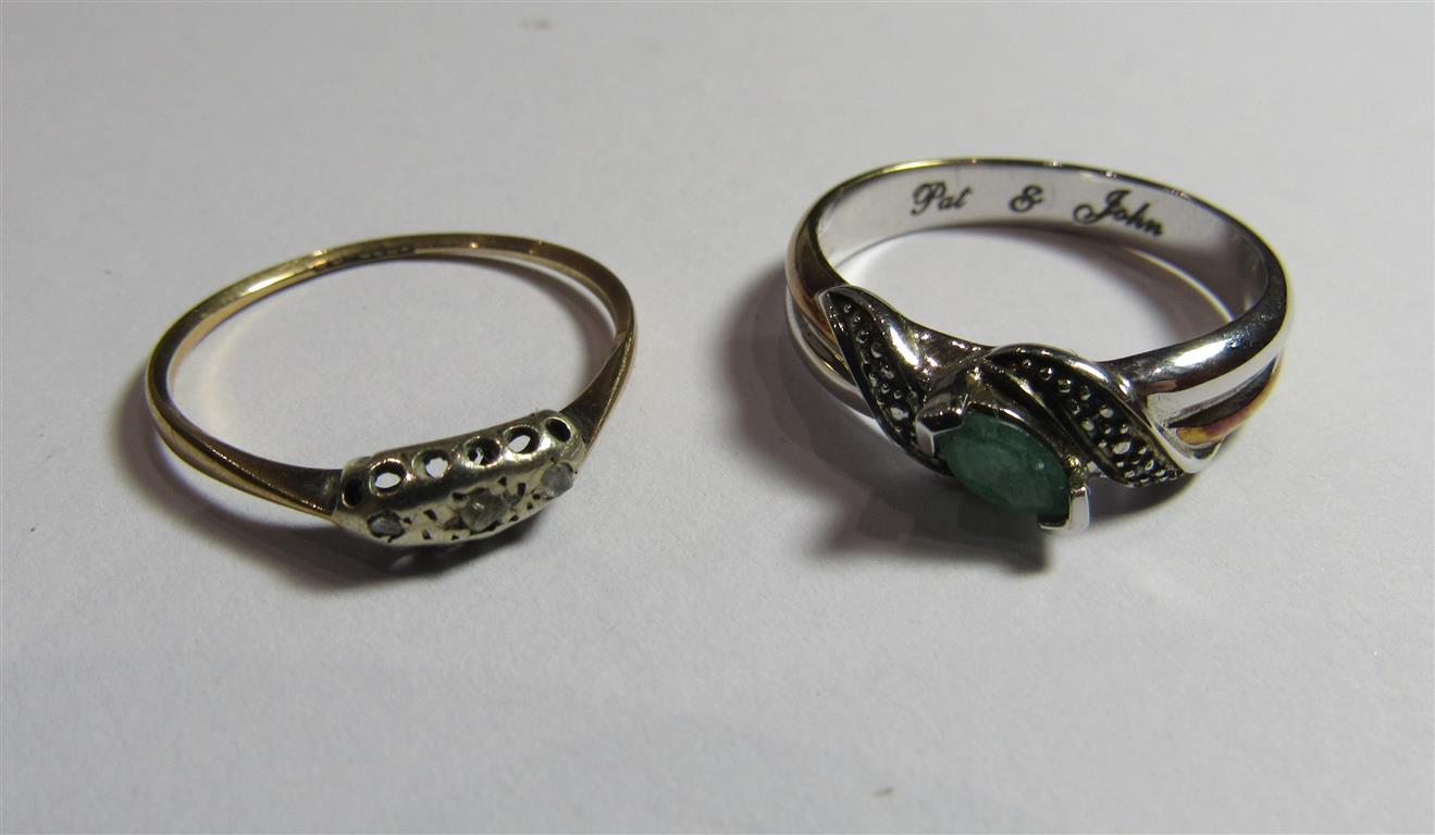 A gold, platinum and diamond accent dress ring, with faded markings ...