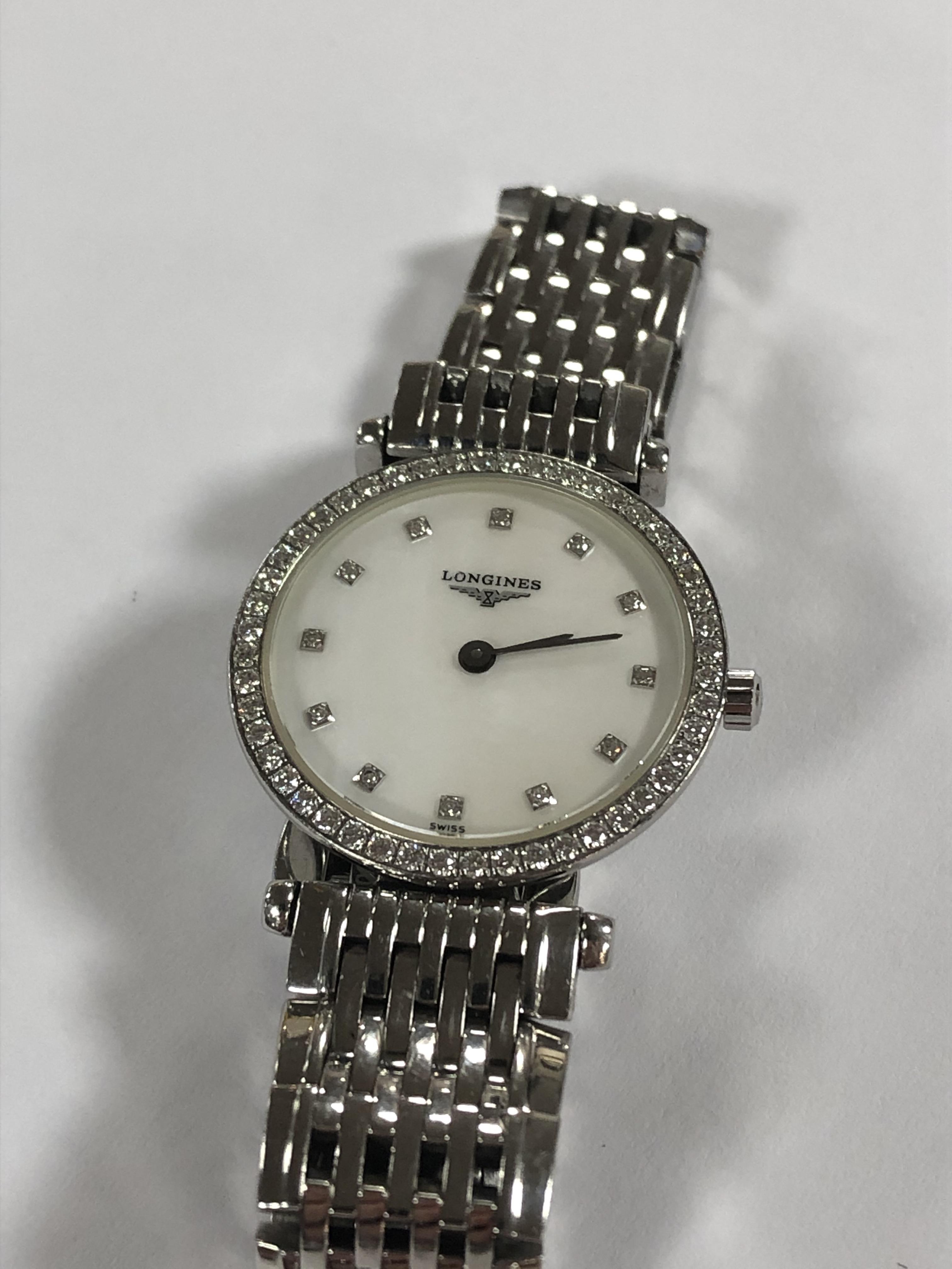 A lady's Longines La Grande Classique wristwatch with diamond set bezel ...
